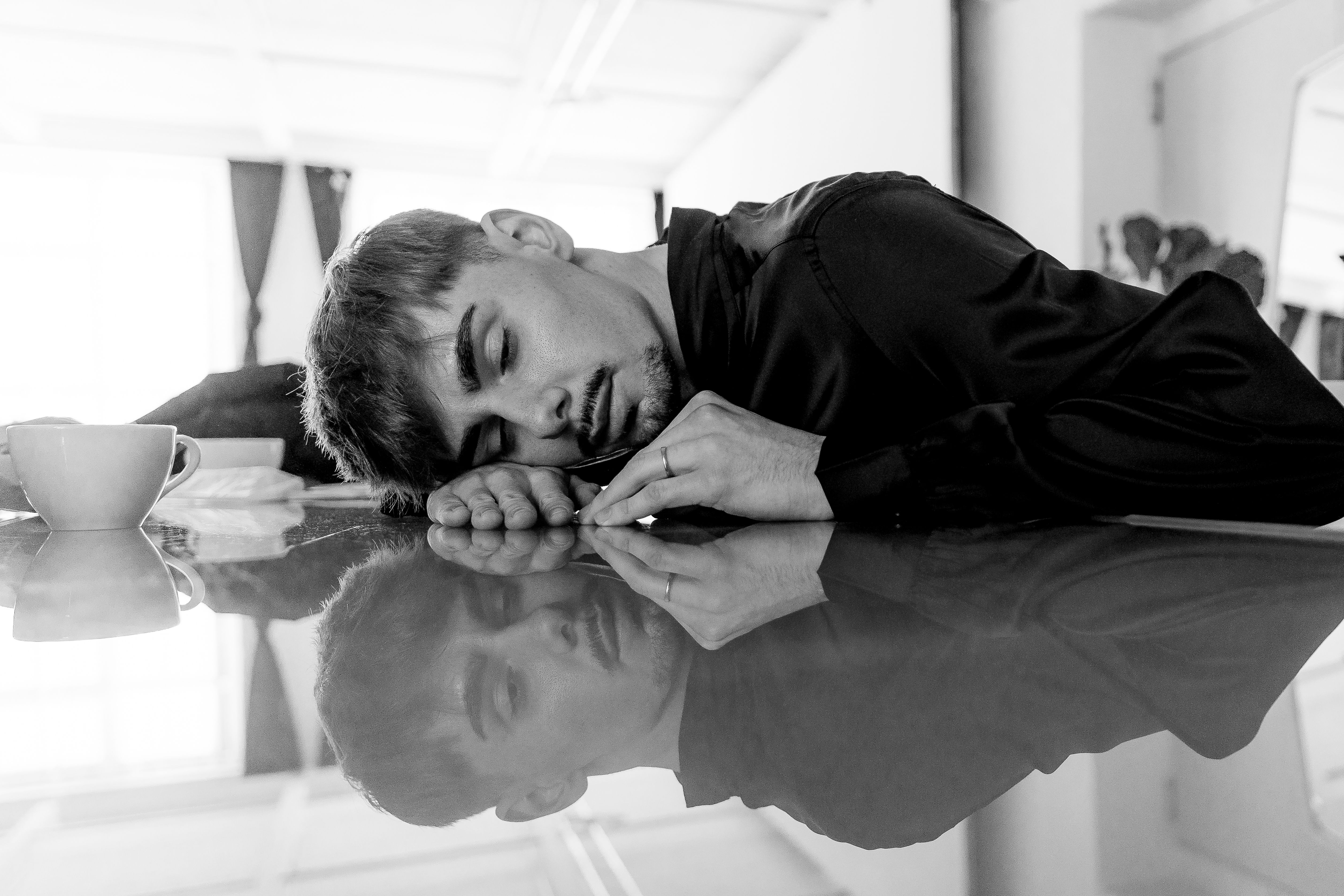 Reflective Portrait of Man Resting on Table · Free Stock Photo