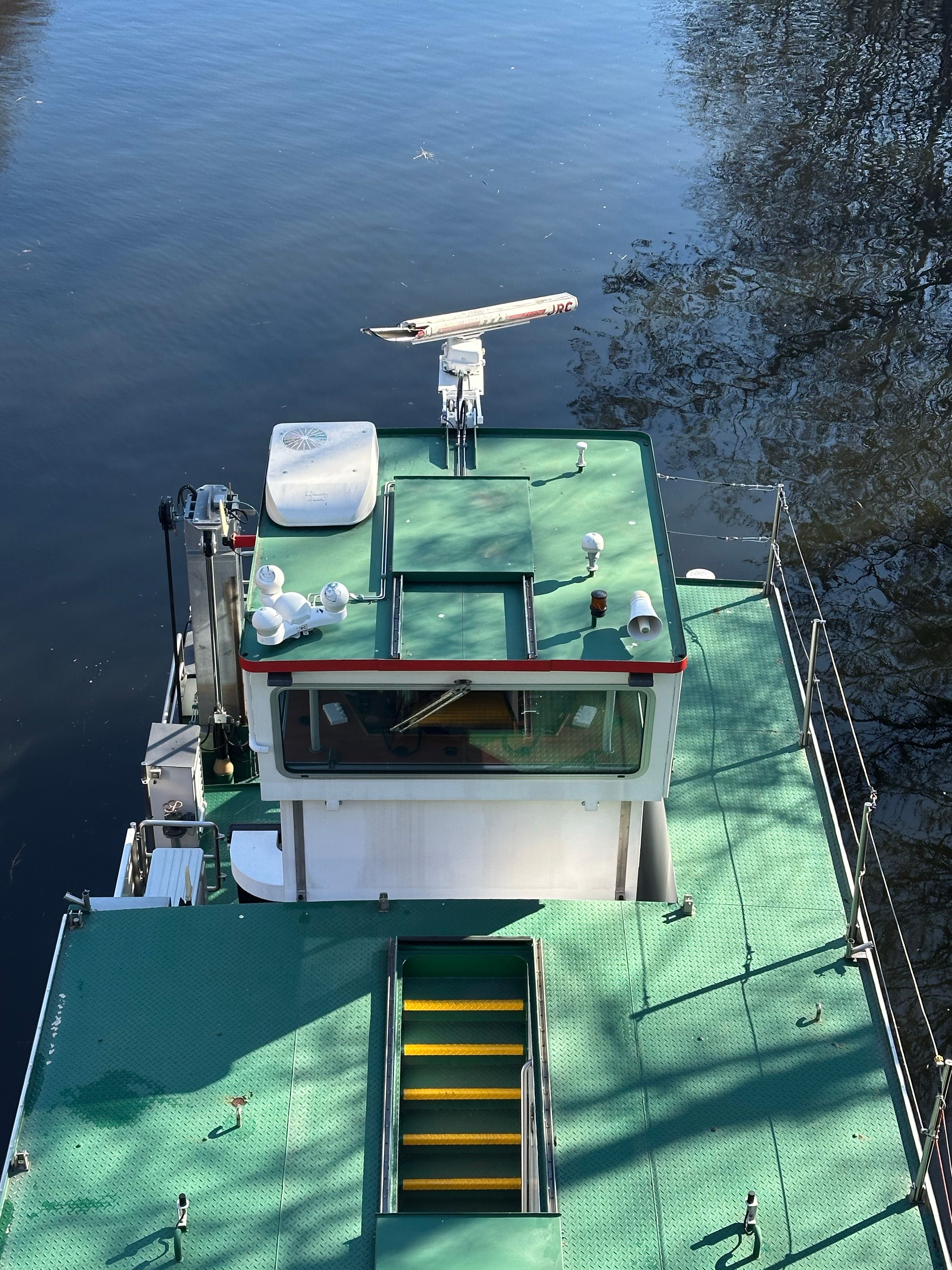 Green Roofed Boat Docked on Calm Water · Free Stock Photo