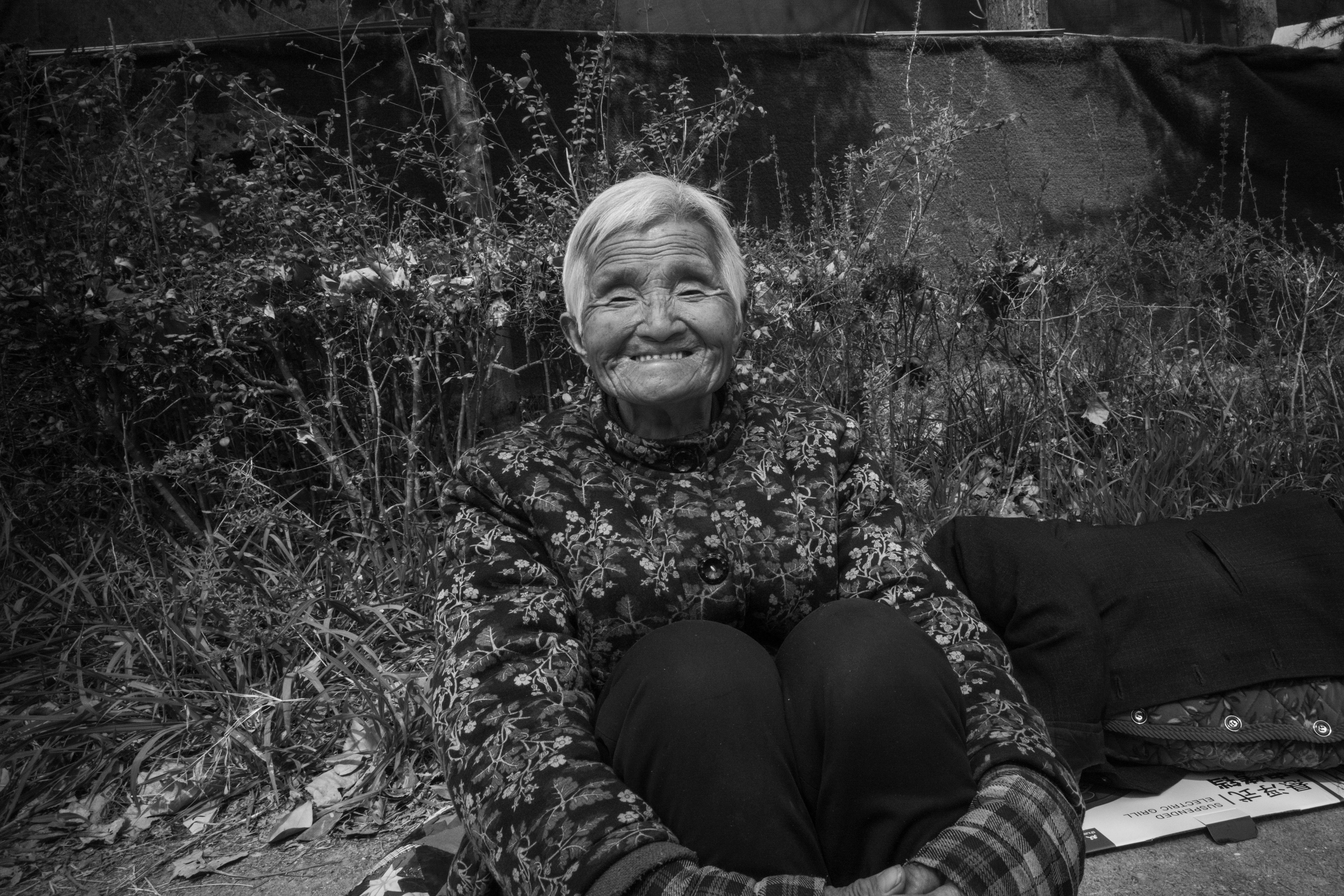 Elderly Woman Smiling in Black and White Portrait · Free Stock Photo