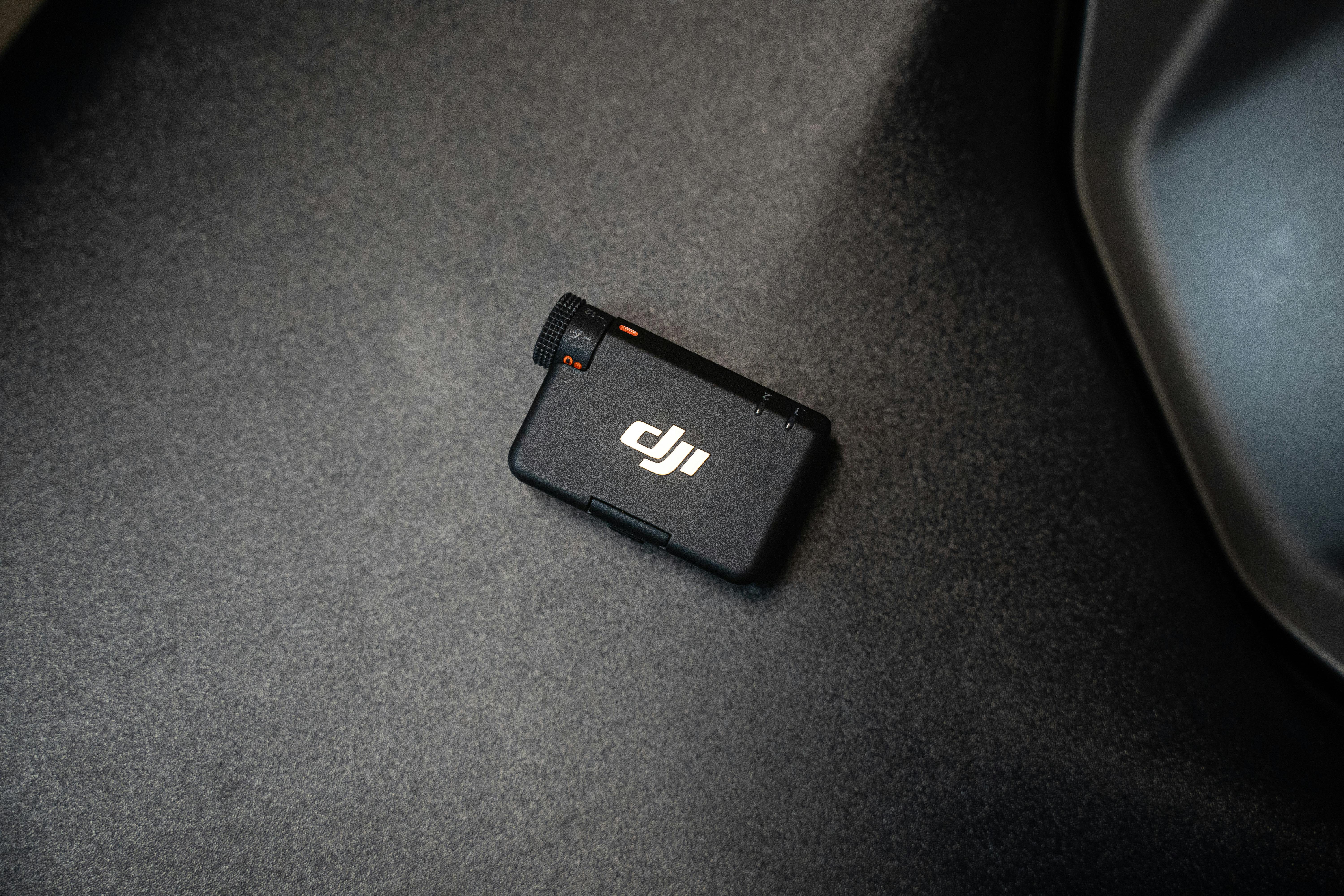 Compact Action Camera on Dark Surface · Free Stock Photo