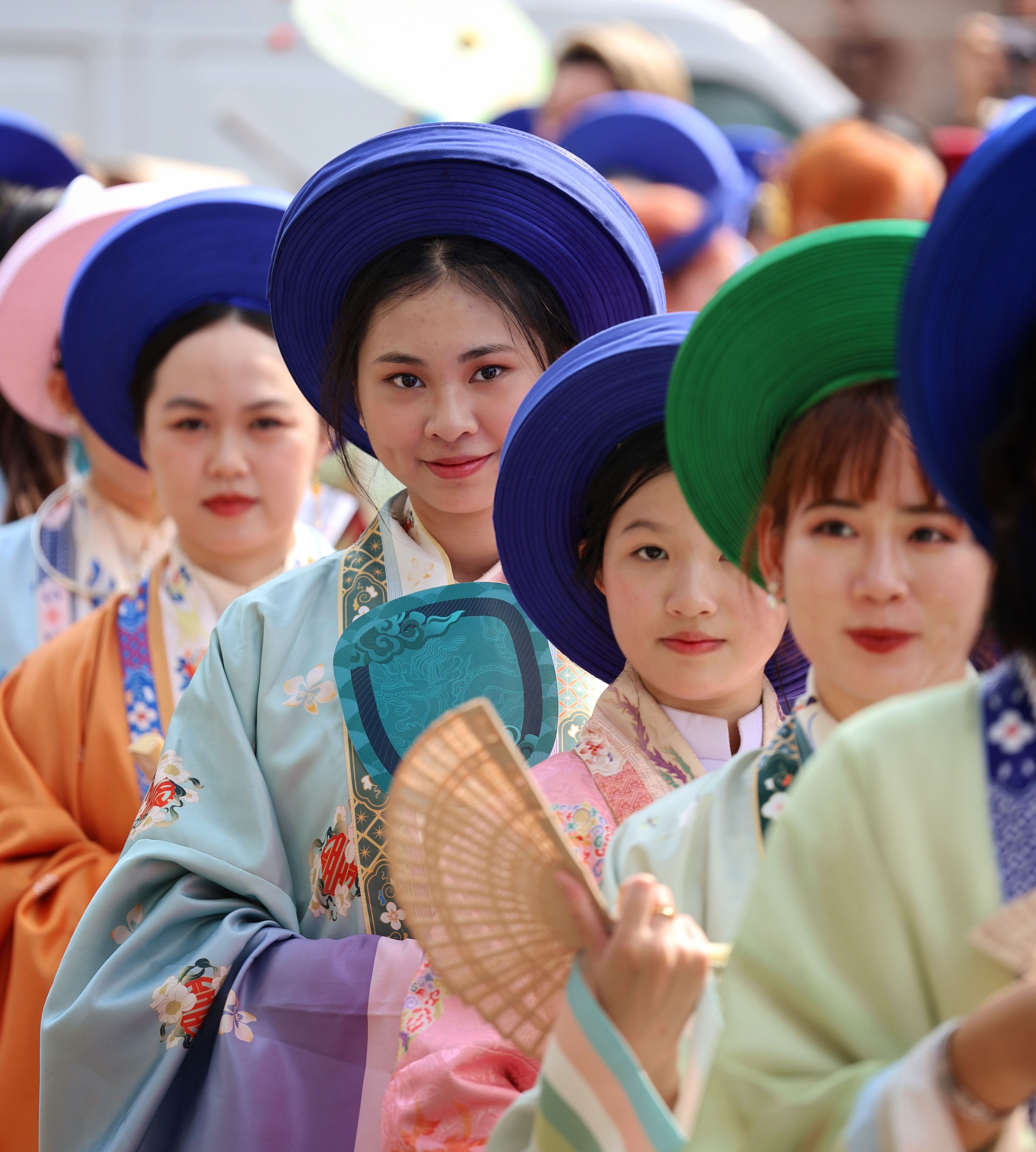 Colorful Cultural Parade with Traditional Attire · Free Stock Photo