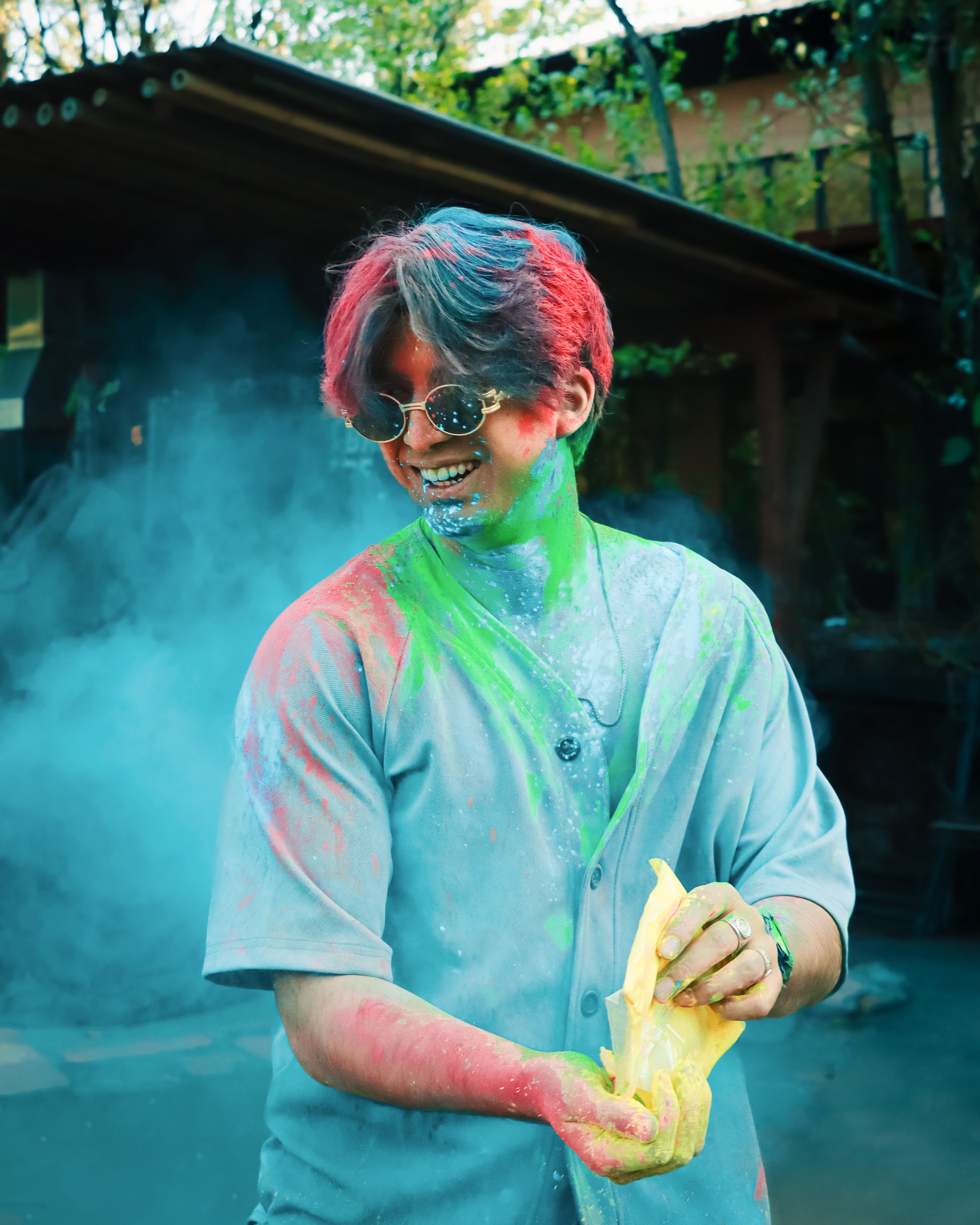 Joyful Man Celebrating Holi with Vibrant Colors · Free Stock Photo