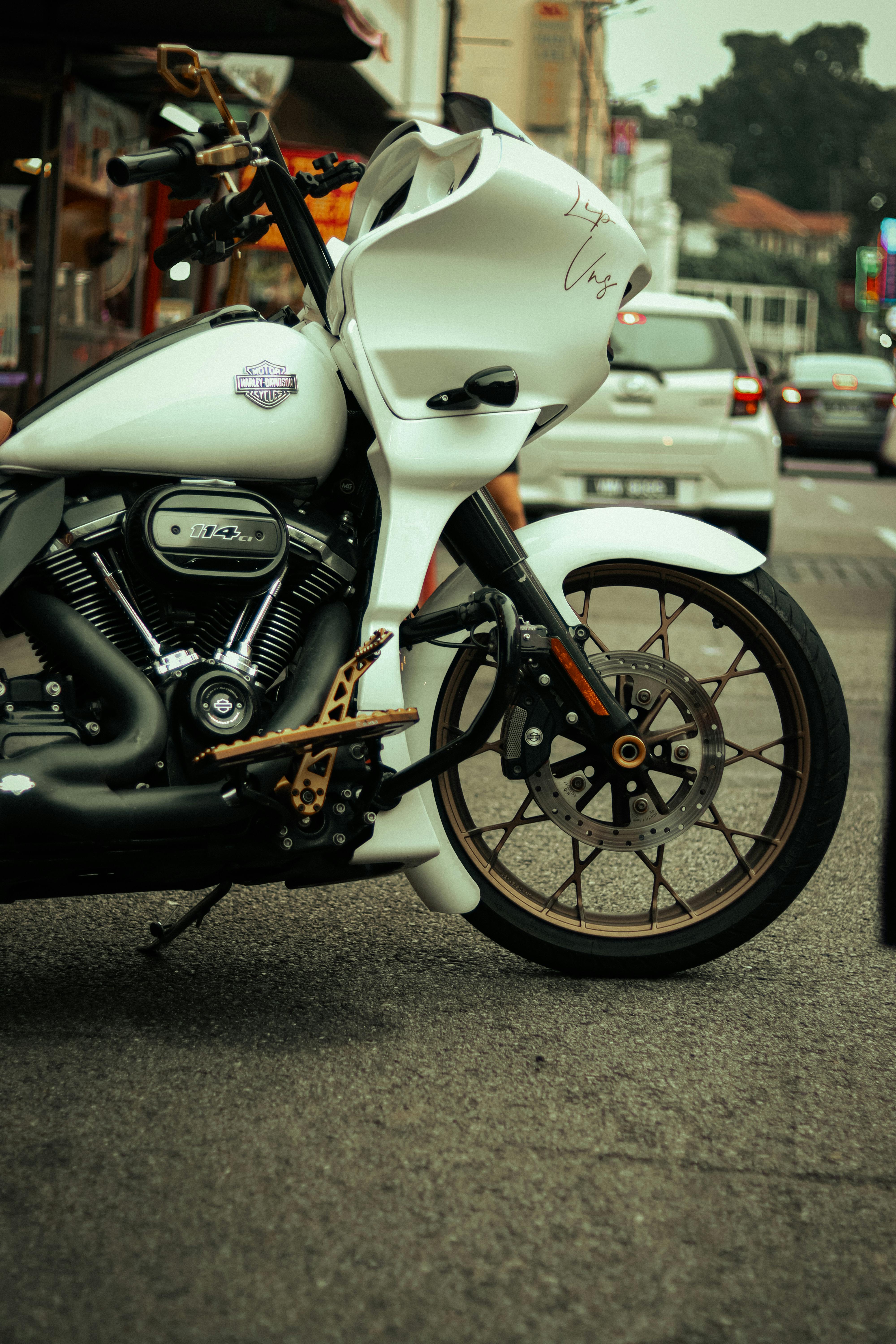 White Motorcycle Parked on Kuala Lumpur Street · Free Stock Photo