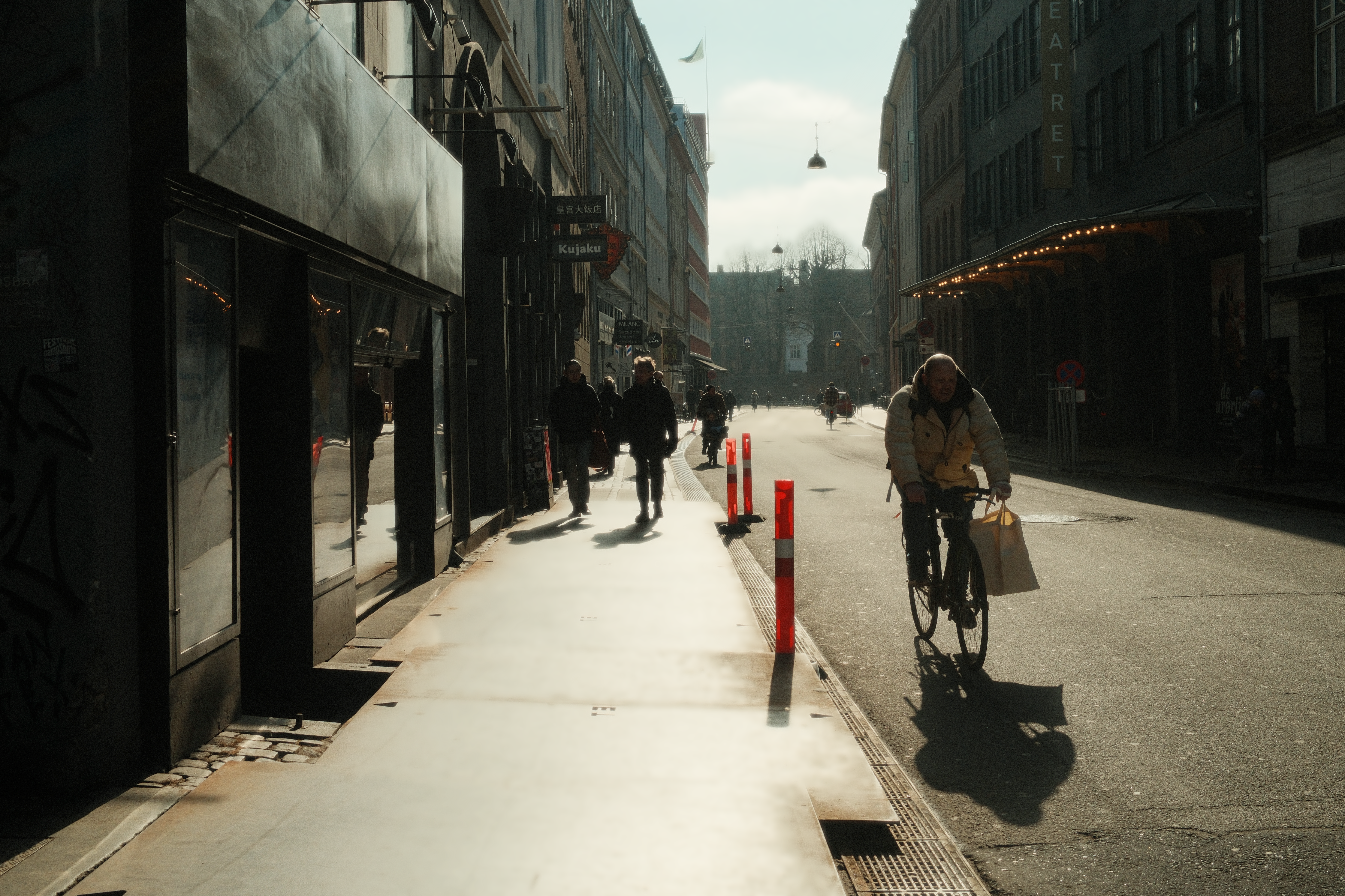 Urban Street Scene with Cyclists in Daylight · Free Stock Photo