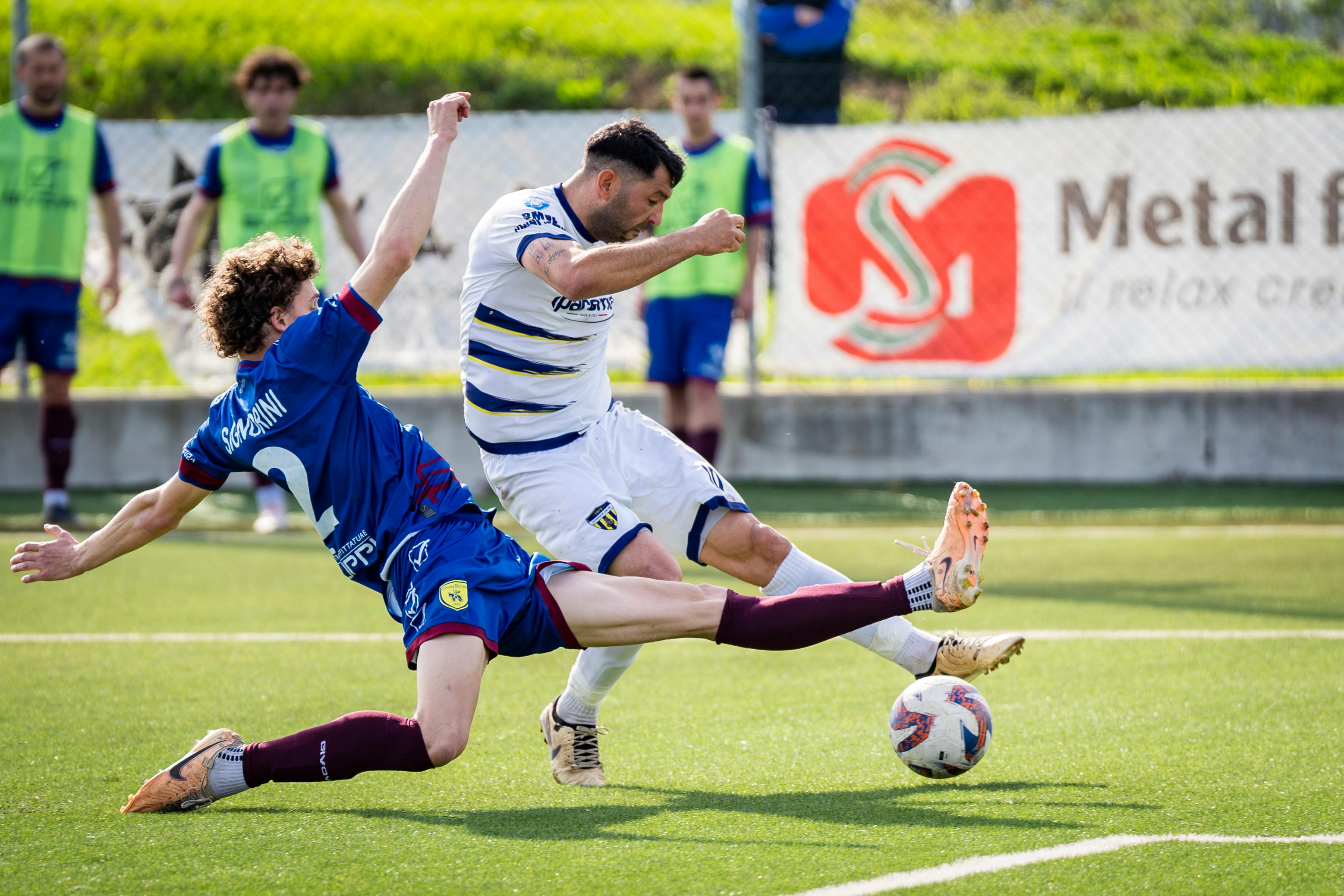 Dynamic Soccer Tackle During Competitive Match · Free Stock Photo