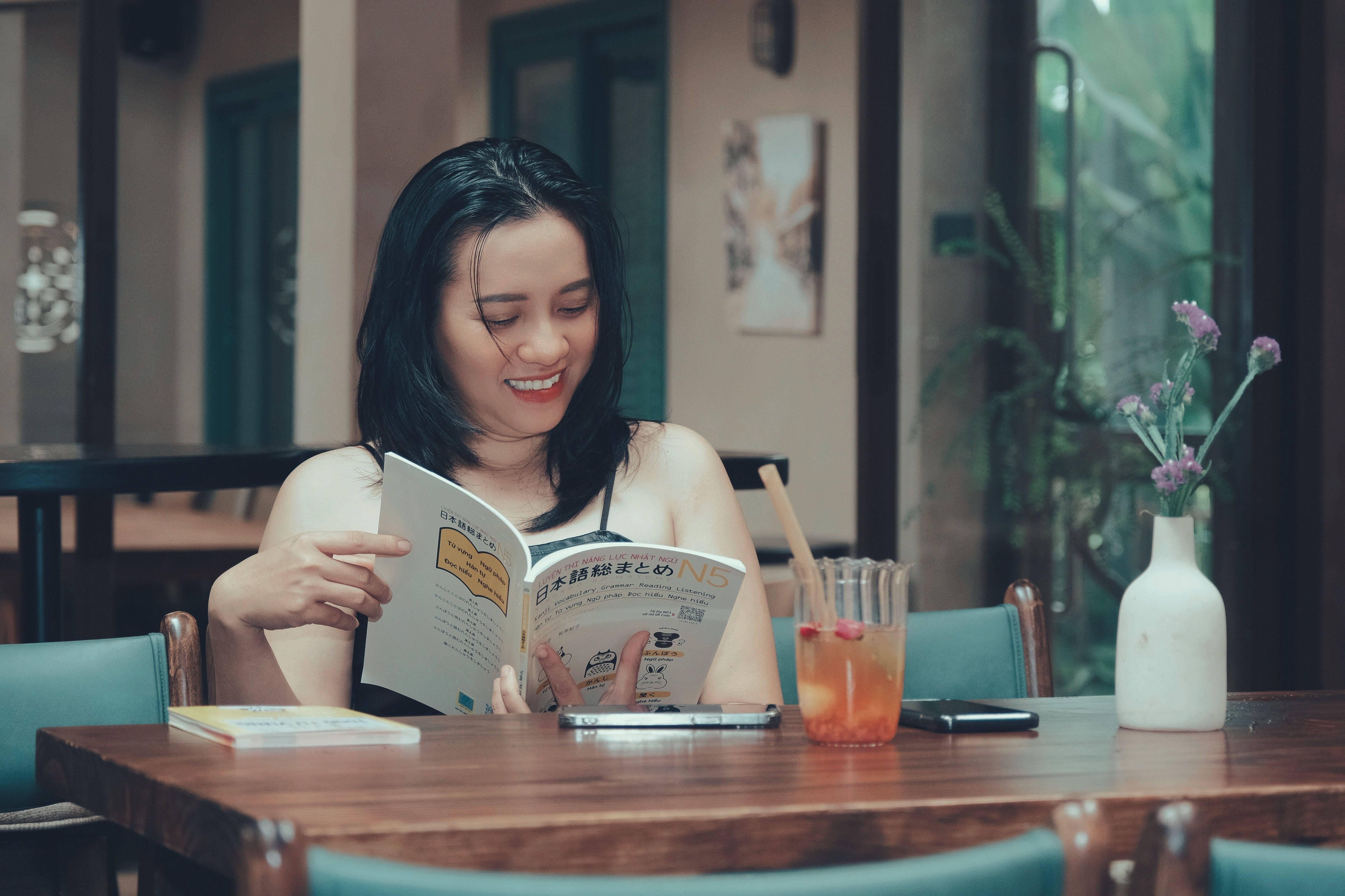 Woman Enjoys Relaxing Afternoon Reading Indoors · Free Stock Photo