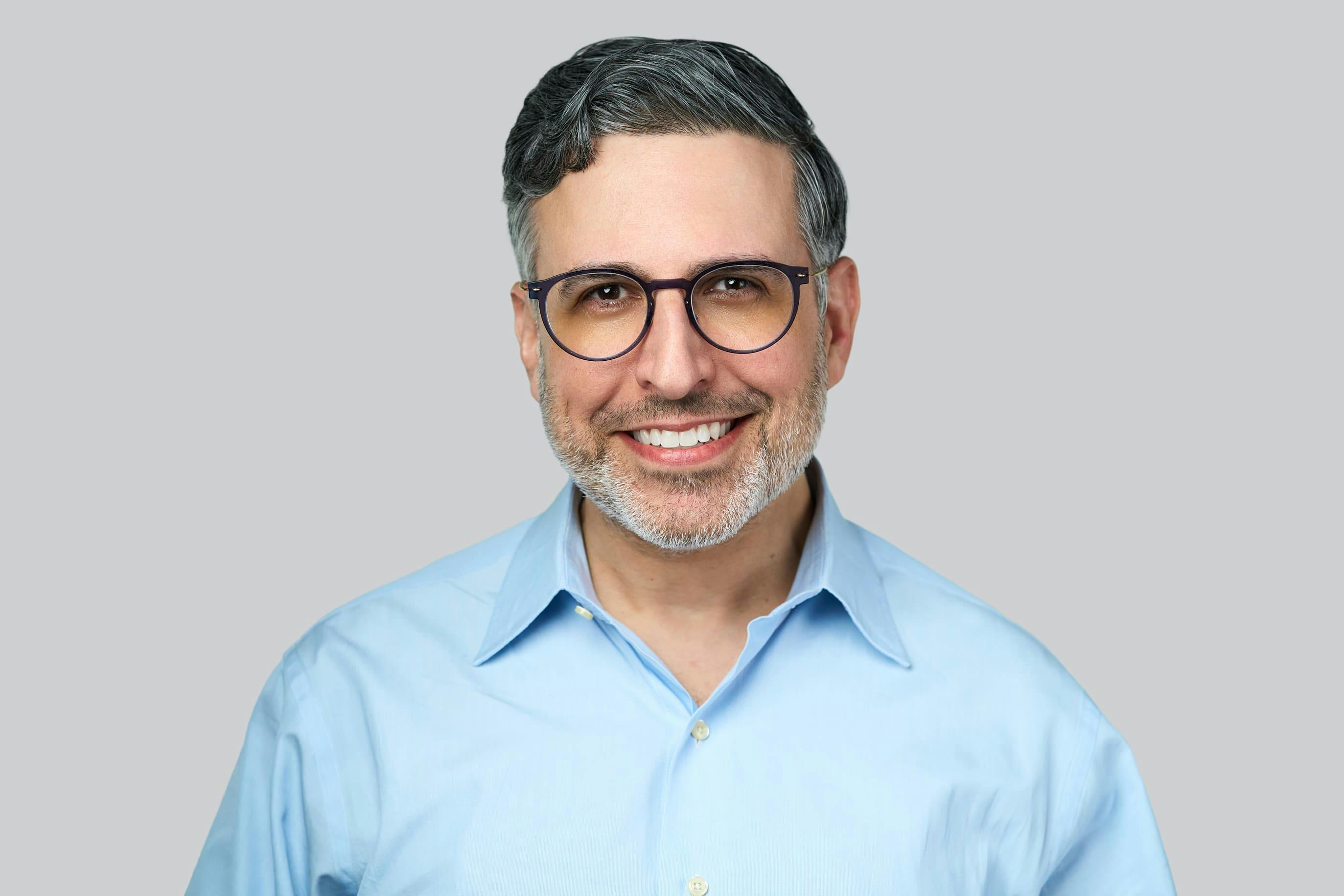 Professional Headshot of Smiling Man with Glasses · Free Stock Photo