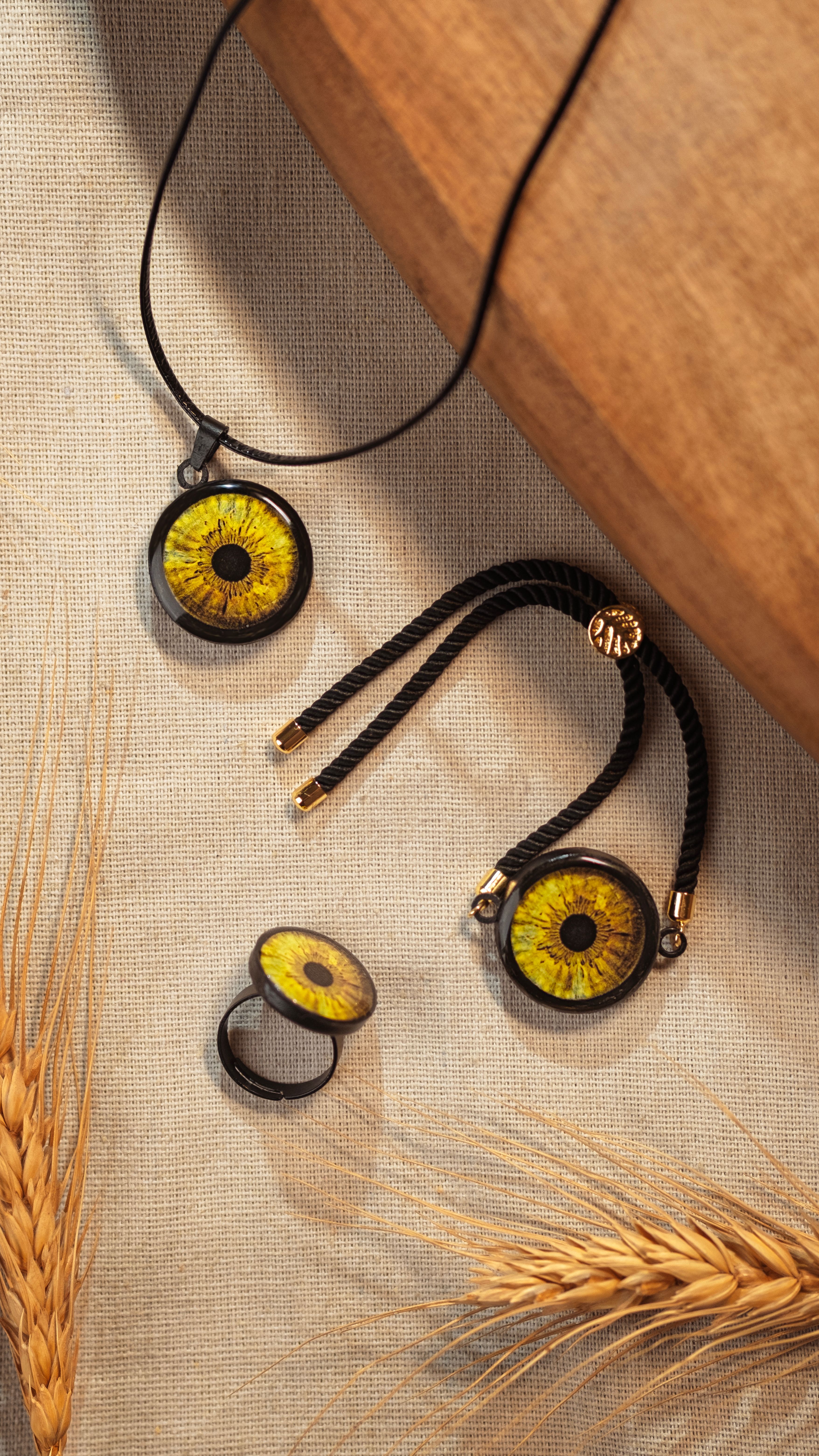 Artistic Eye Jewelry on Natural Fabric Background · Free Stock Photo