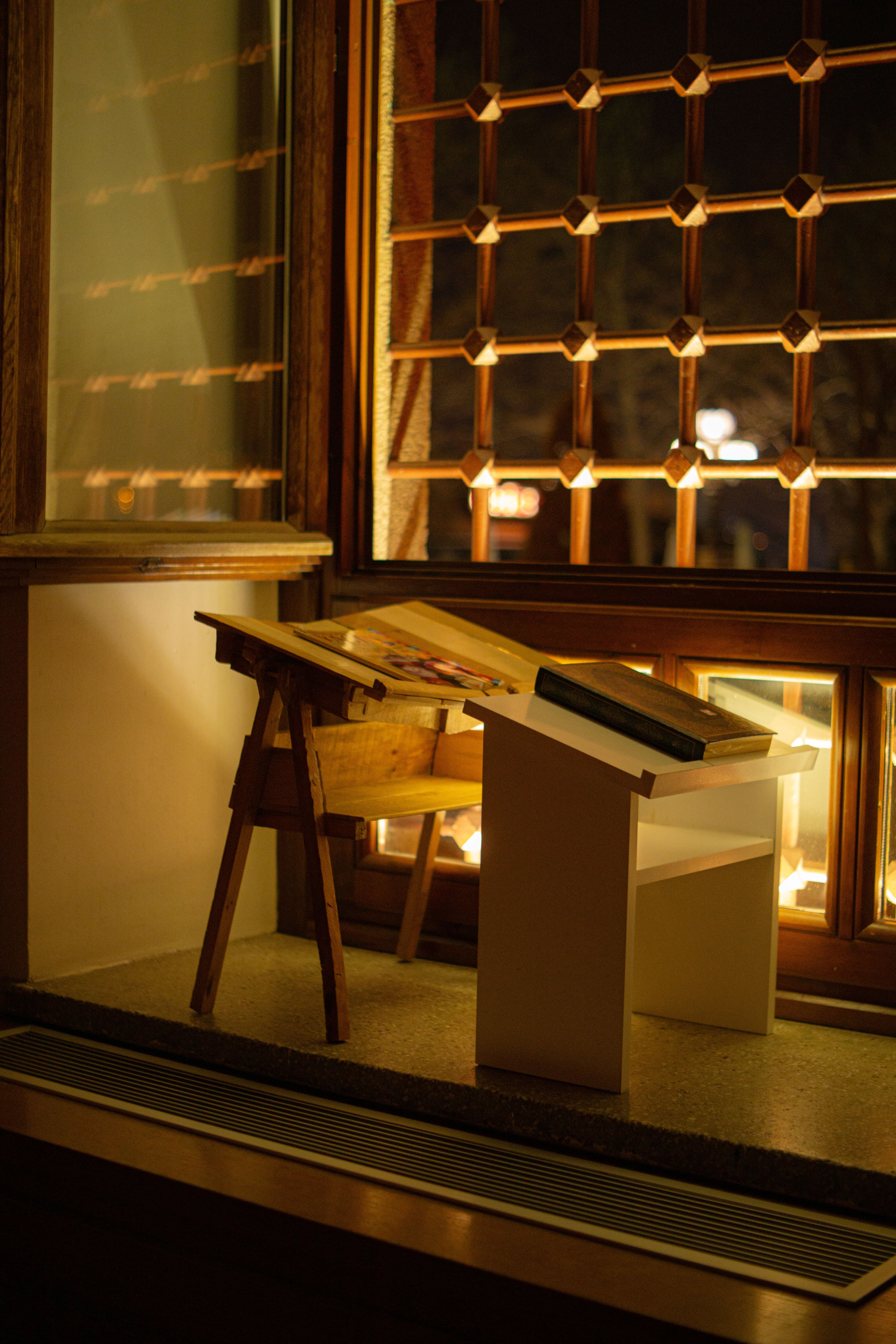 Serene Mosque Interior at Night with Wooden Lectern · Free Stock Photo