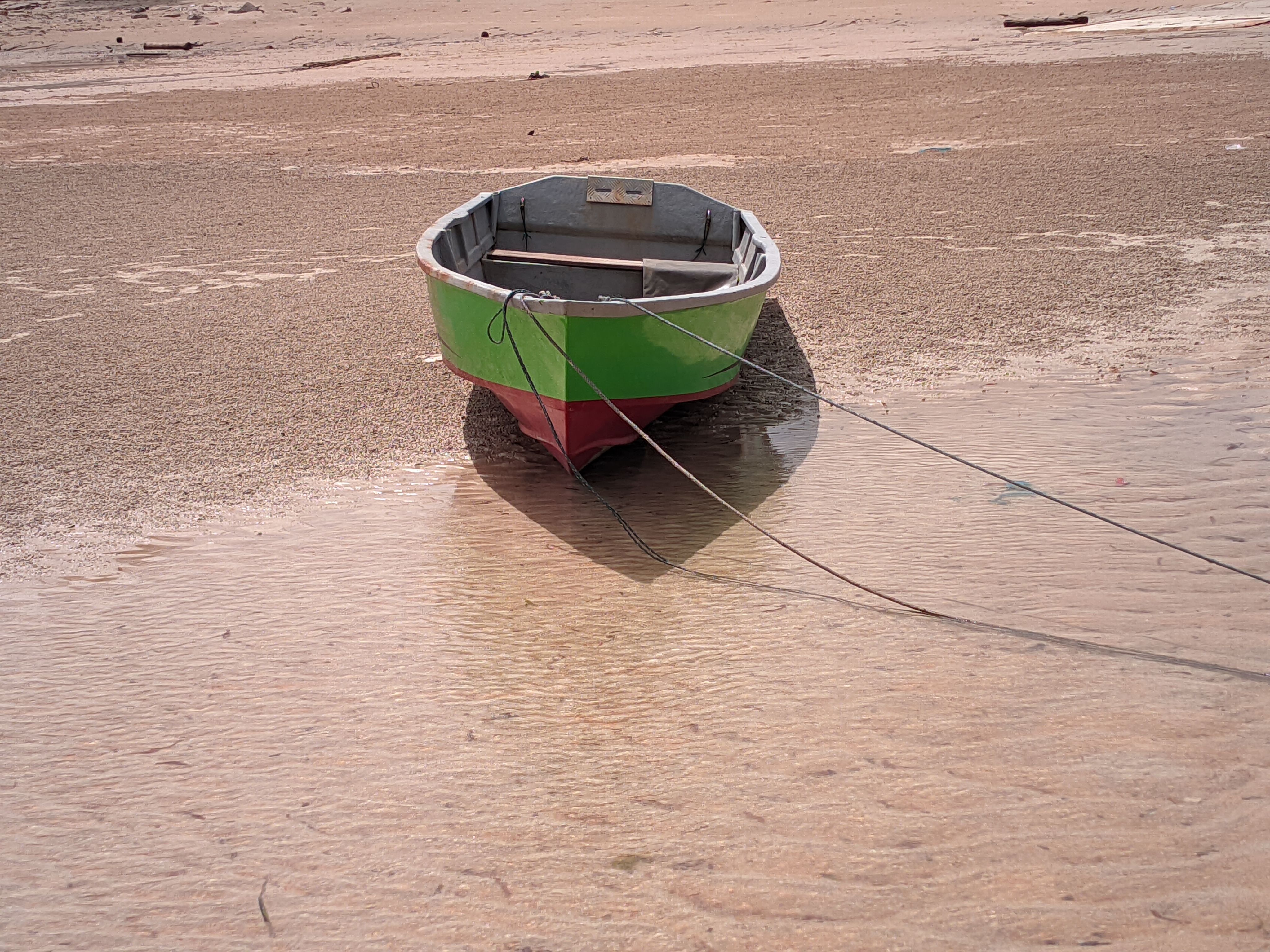 Stranded Boat on Sandy Beach at Low Tide · Free Stock Photo