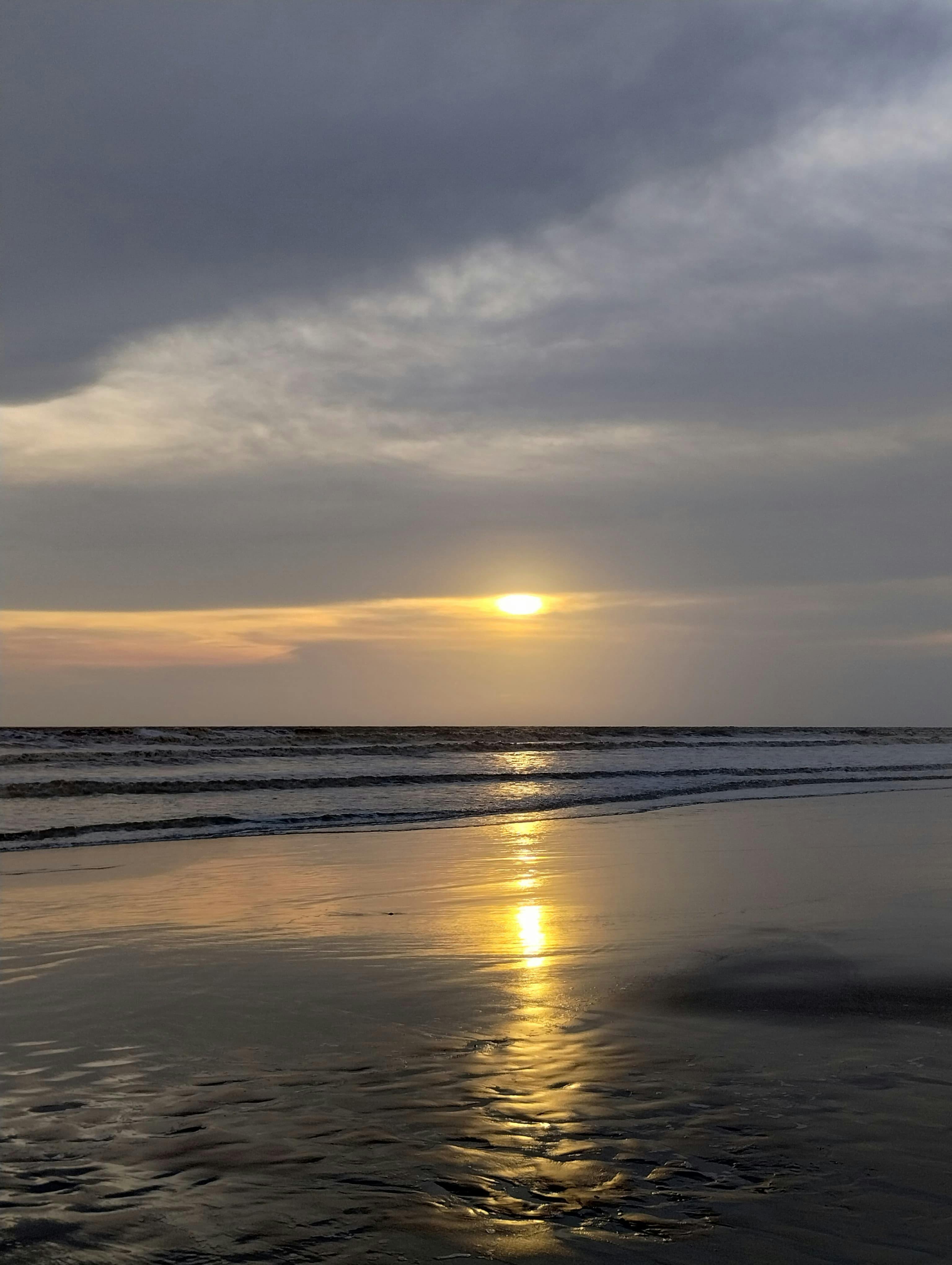 Calm Beach Sunset Reflecting on Water · Free Stock Photo