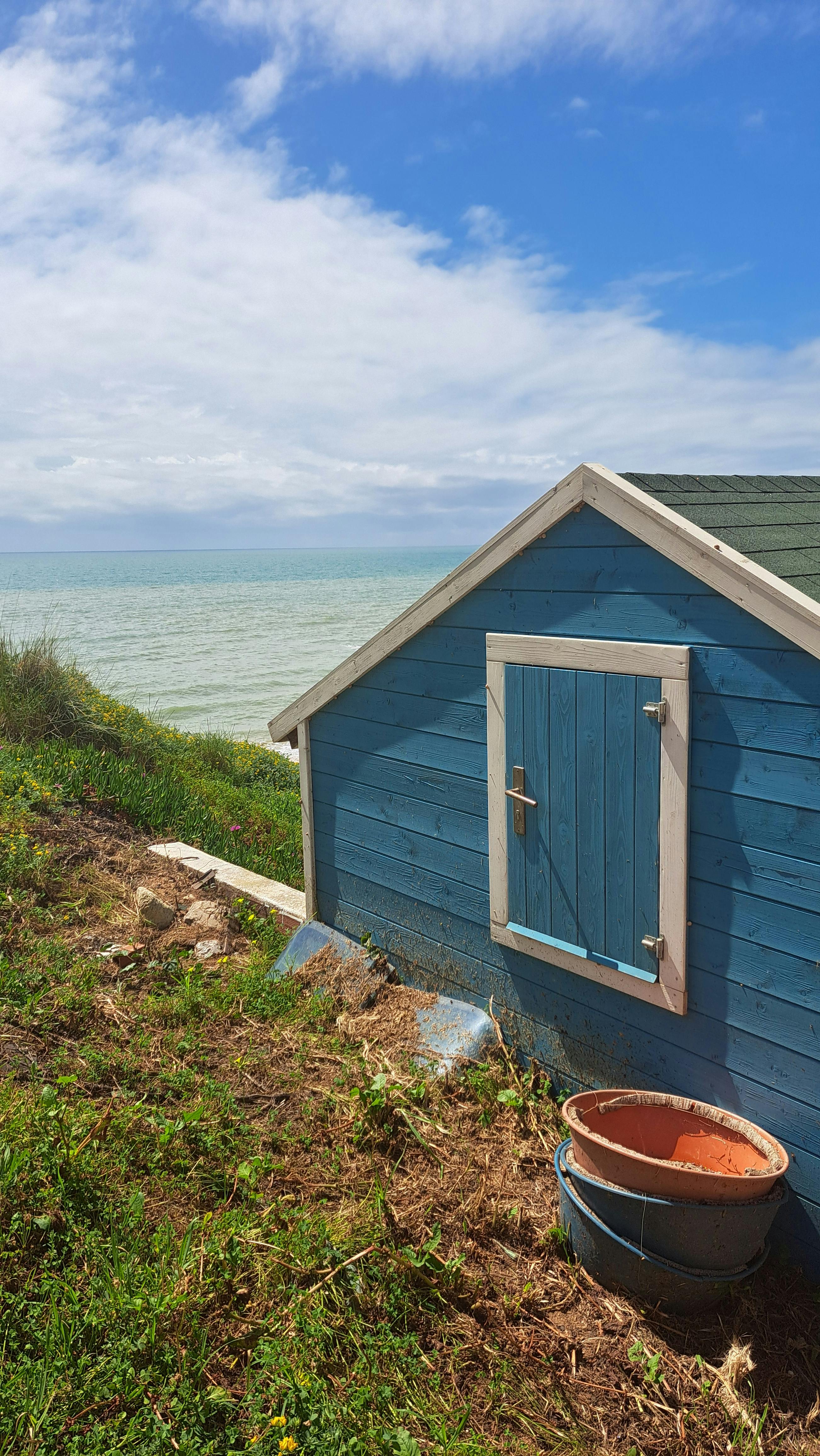 Blue Beach Hut Overlooking Atlantic Ocean · Free Stock Photo