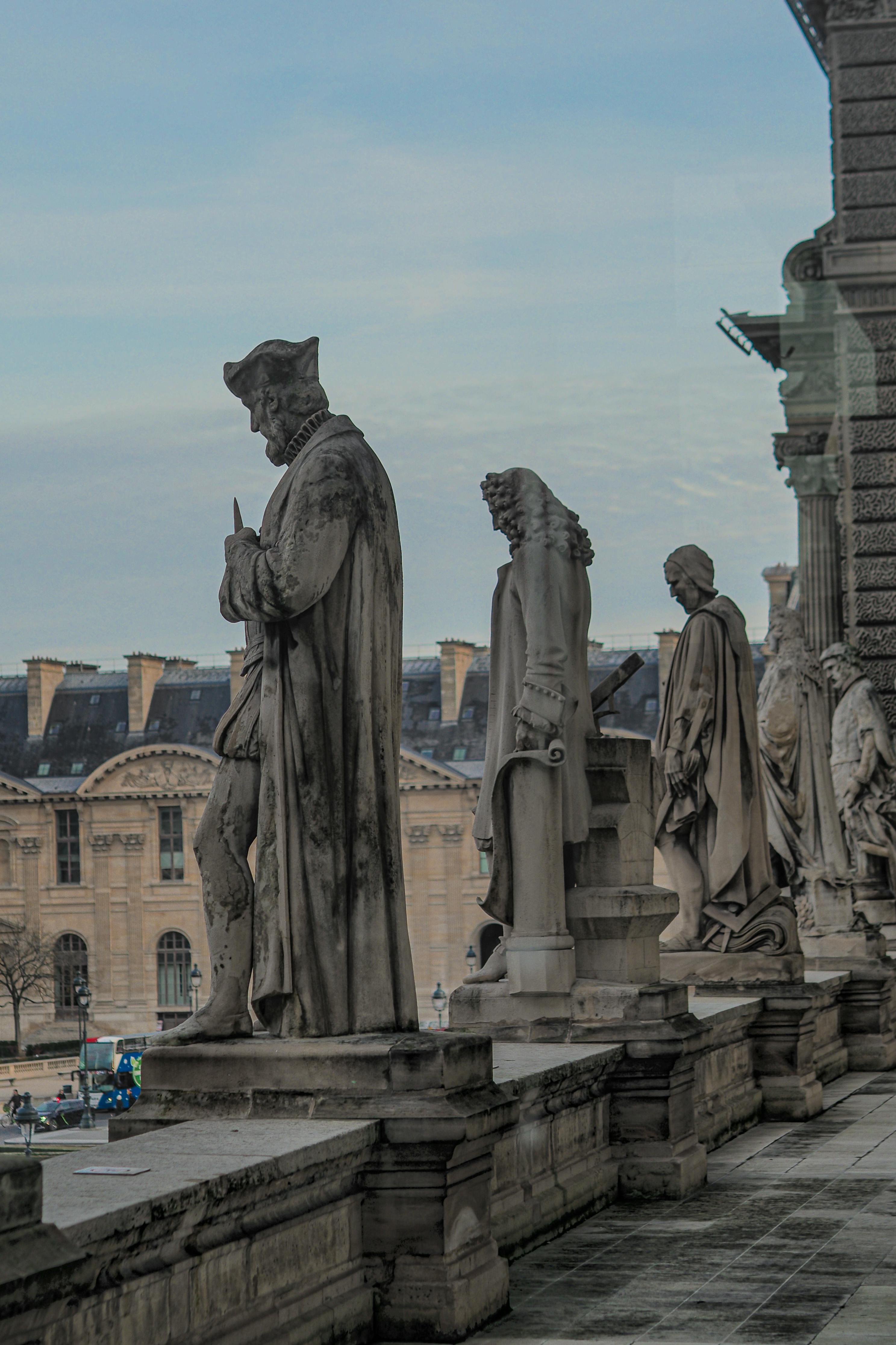Statues Overlooking Historic Parisian Architecture · Free Stock Photo