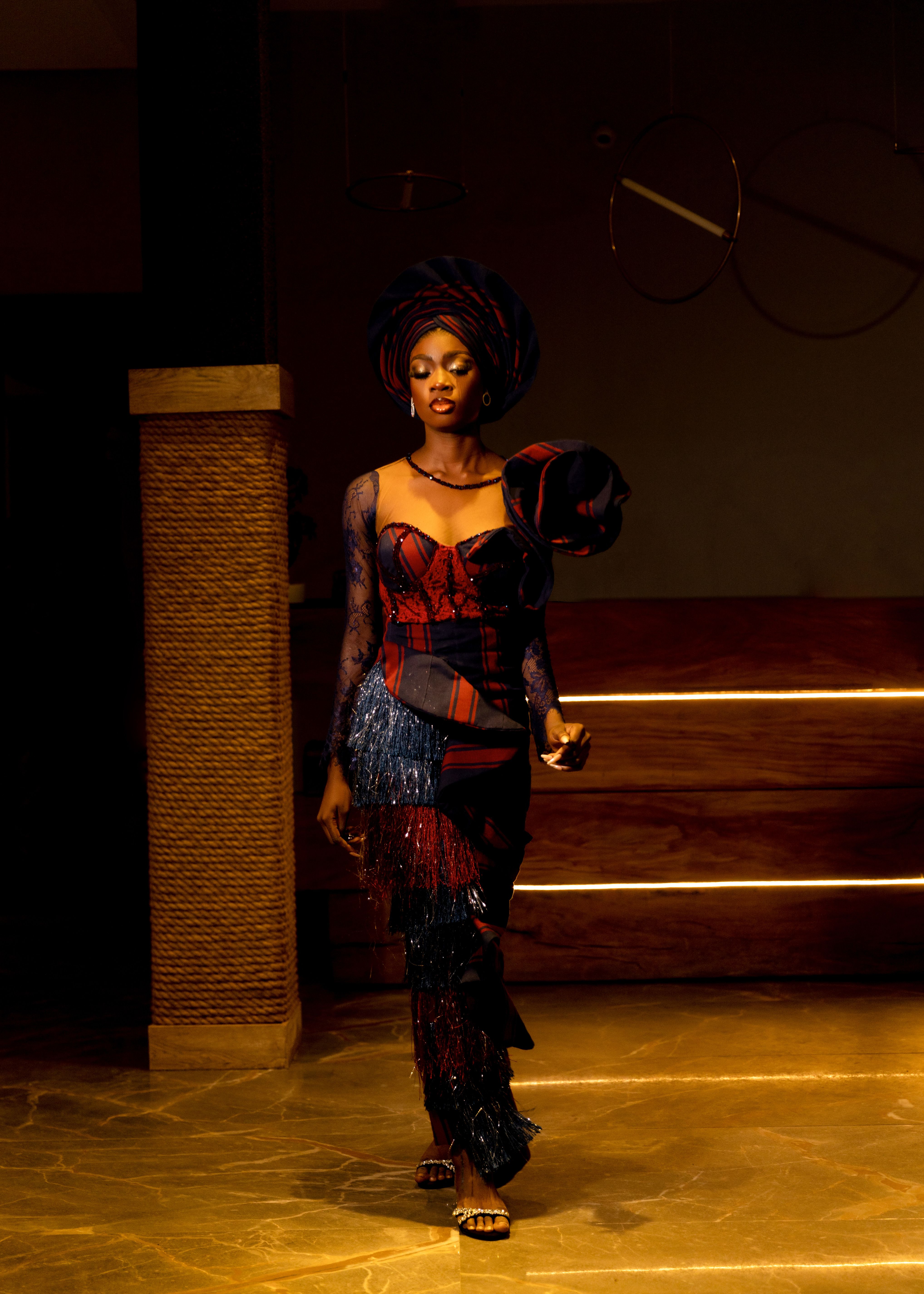 Elegant African Fashion Runway Model in Vibrant Attire · Free Stock Photo