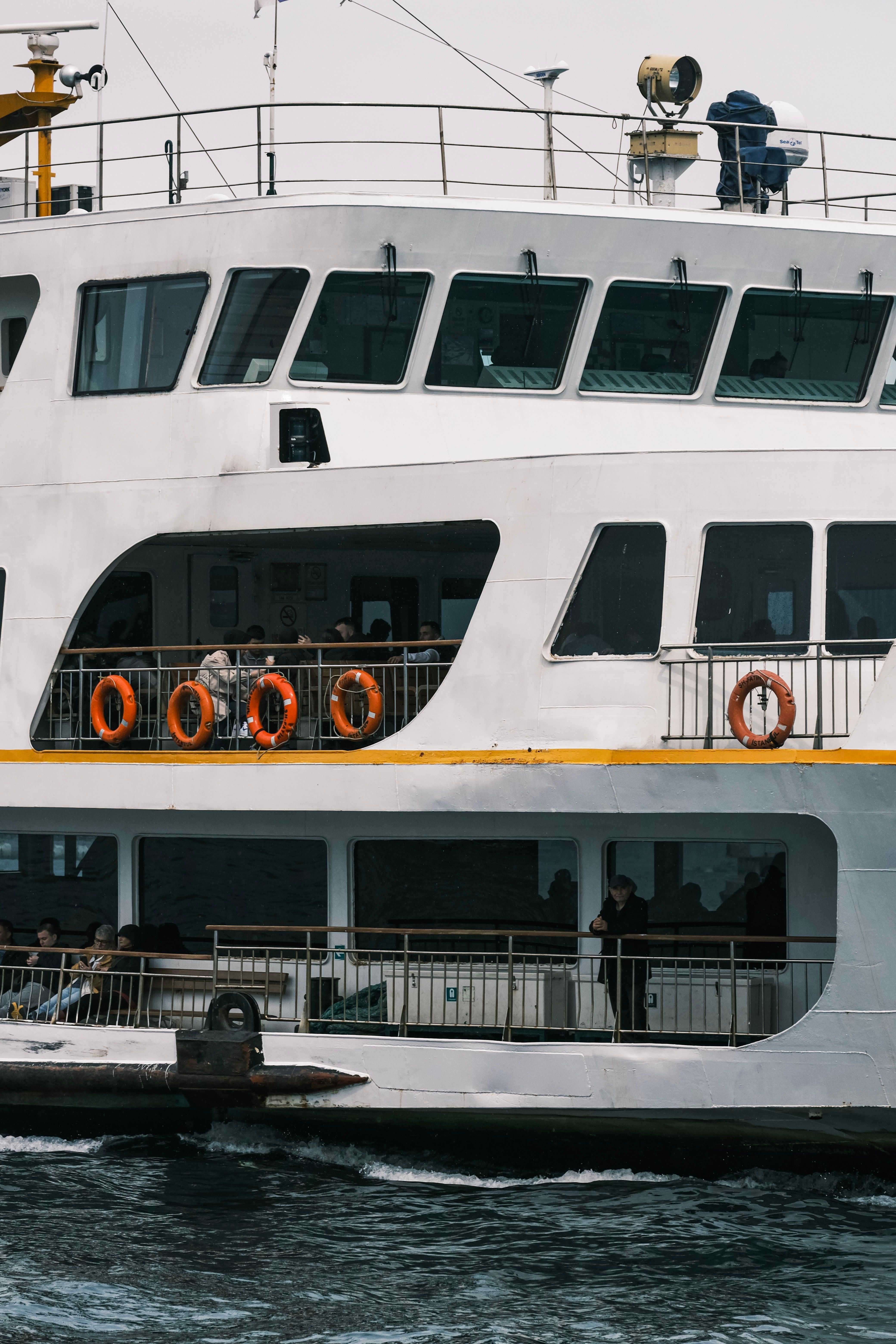 Passenger Ferry with People Aboard on Calm Water · Free Stock Photo