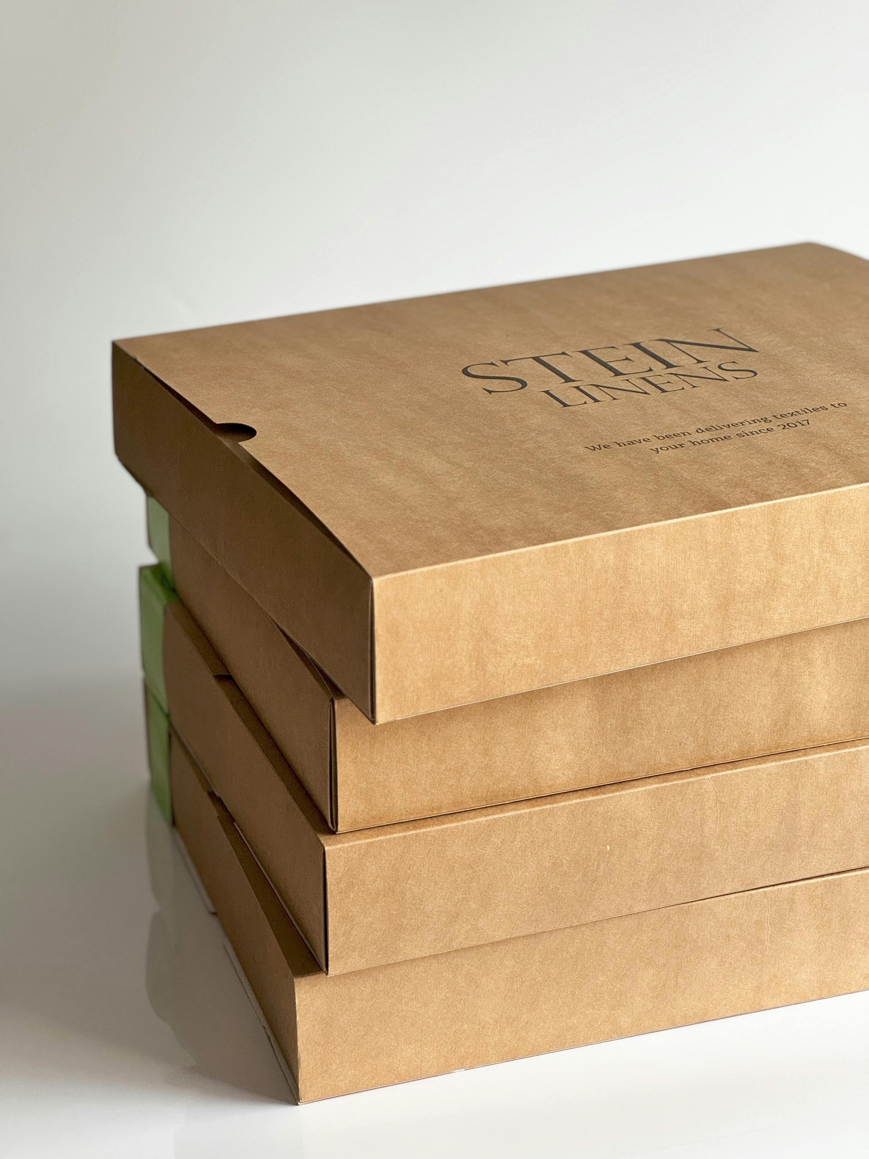 Stack of Eco-Friendly Packaging Boxes · Free Stock Photo