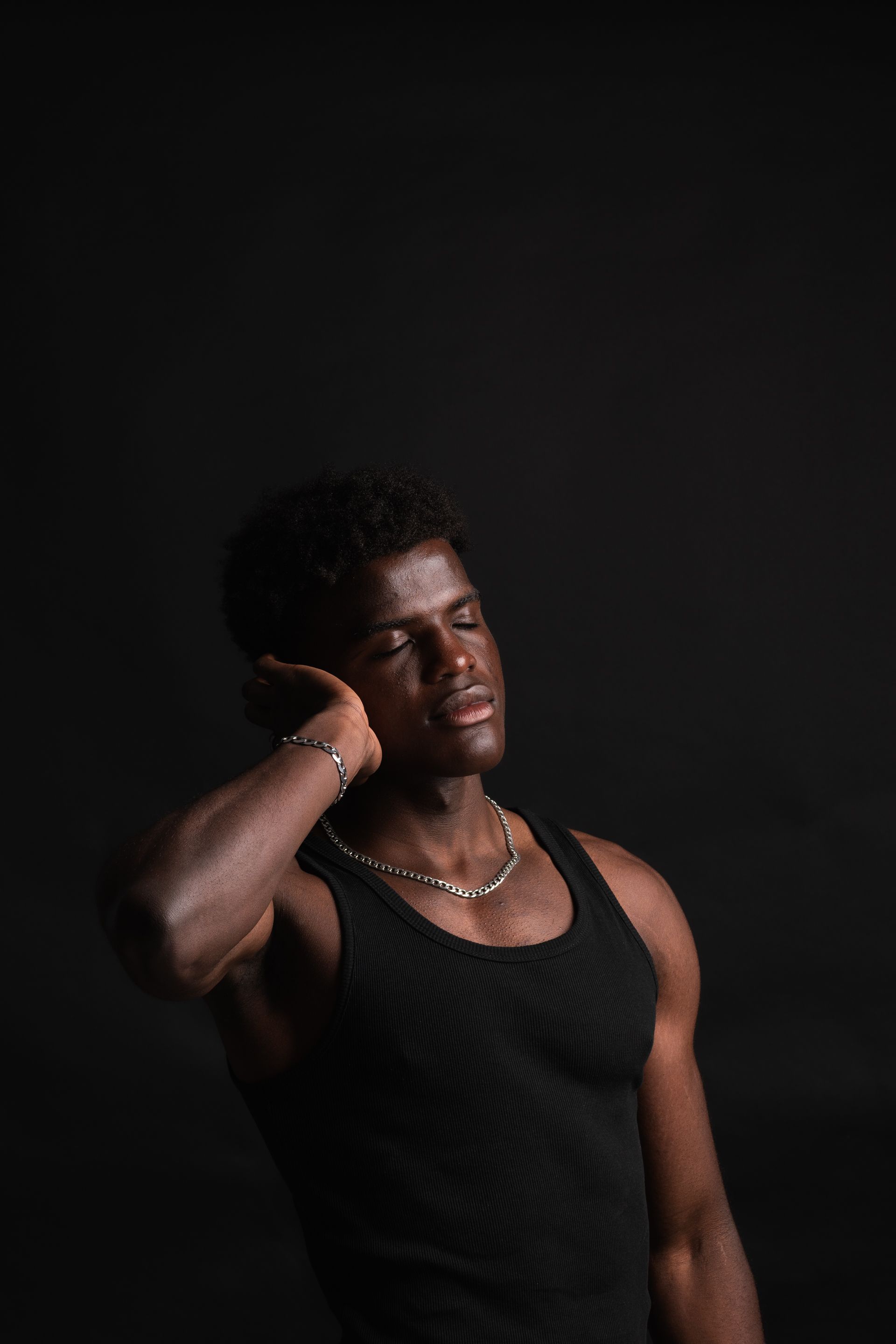 Serene Male Portrait in Studio Setting · Free Stock Photo