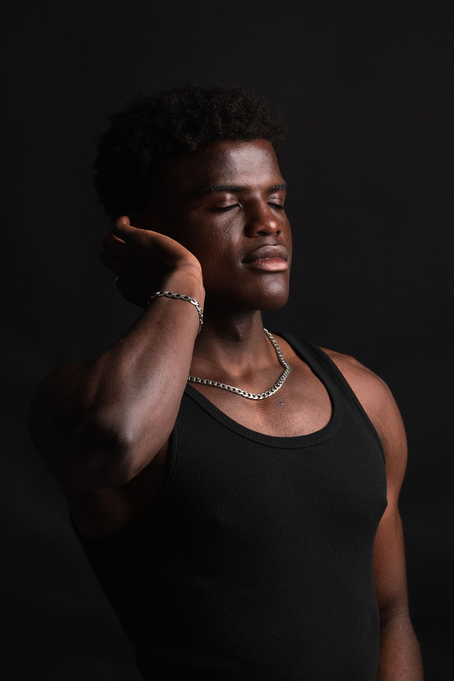 Serene Male Portrait in Studio Setting · Free Stock Photo