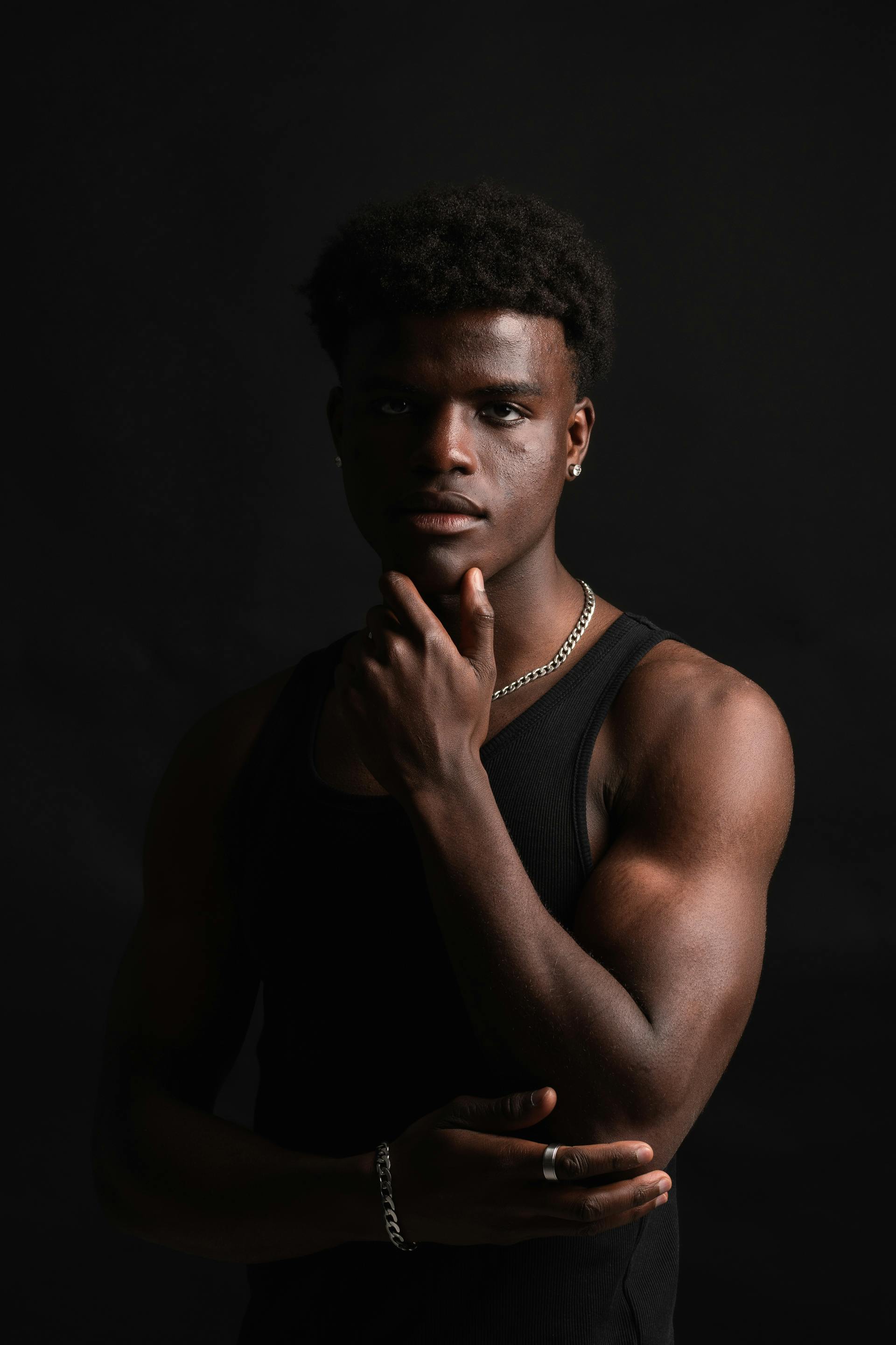 Confident Male Model Posing in Studio Portrait · Free Stock Photo