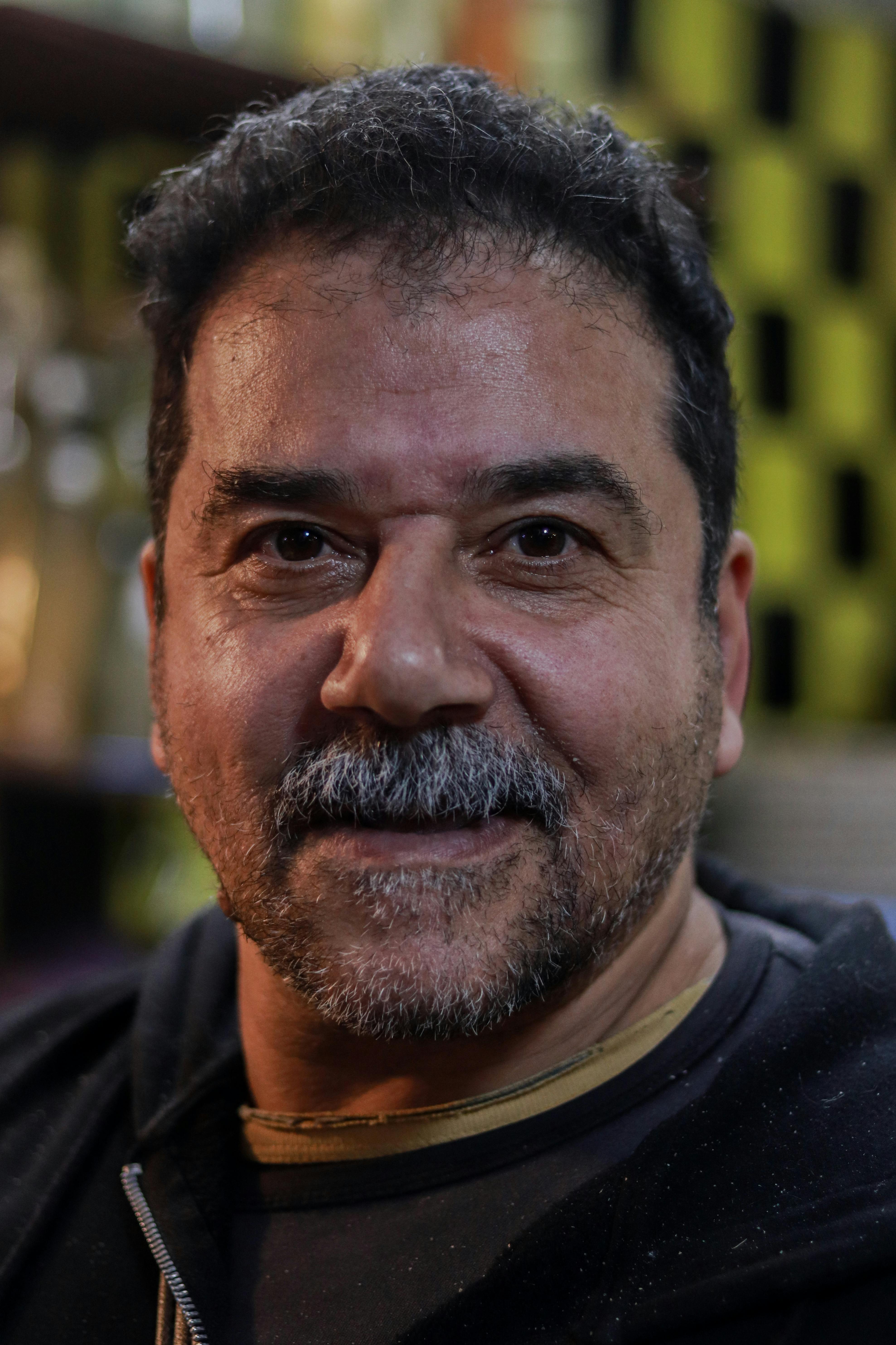 Portrait of Smiling Middle-Aged Man Indoors · Free Stock Photo