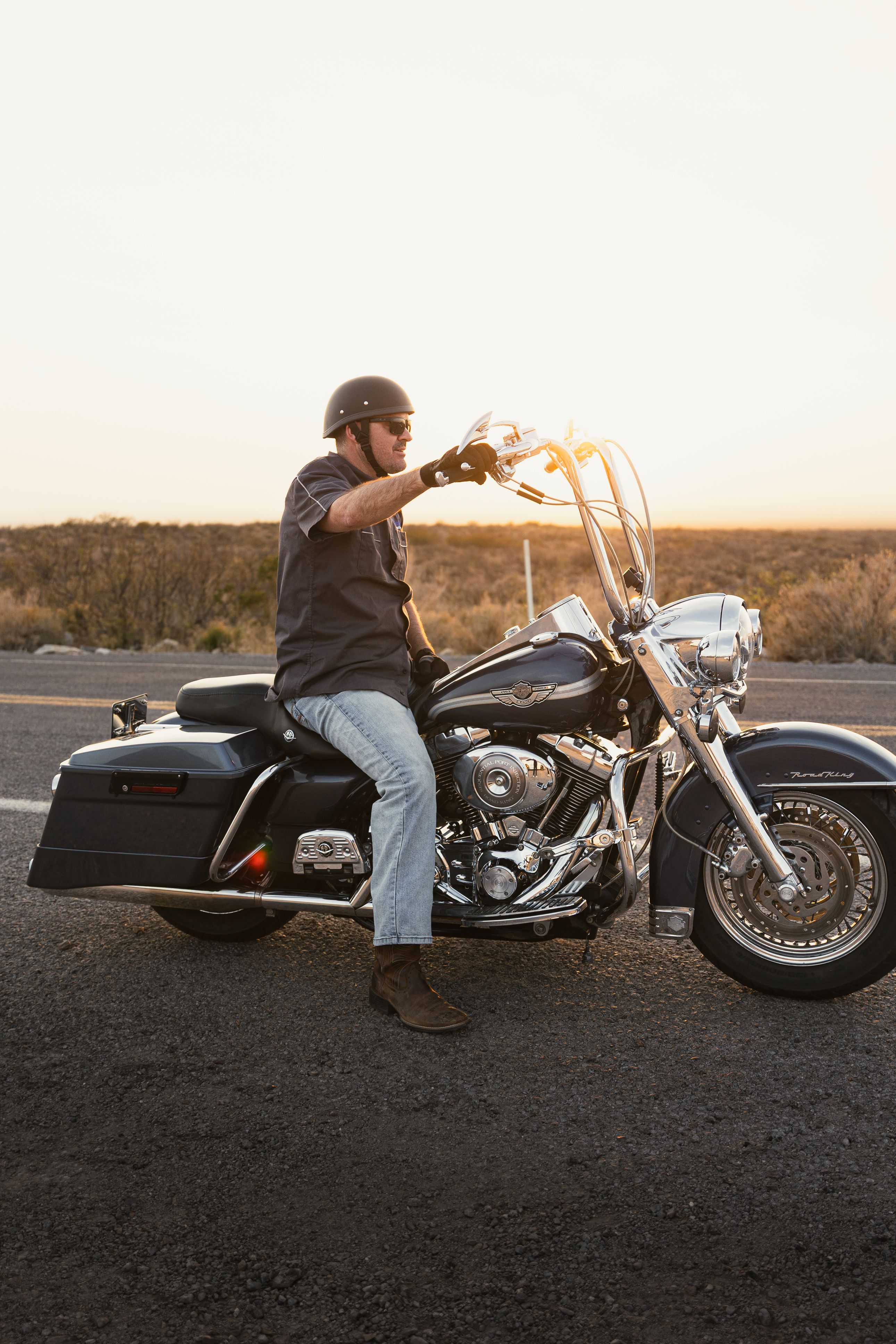 Motorcyclist on Harley-Davidson at Sunset in New Mexico · Free Stock Photo
