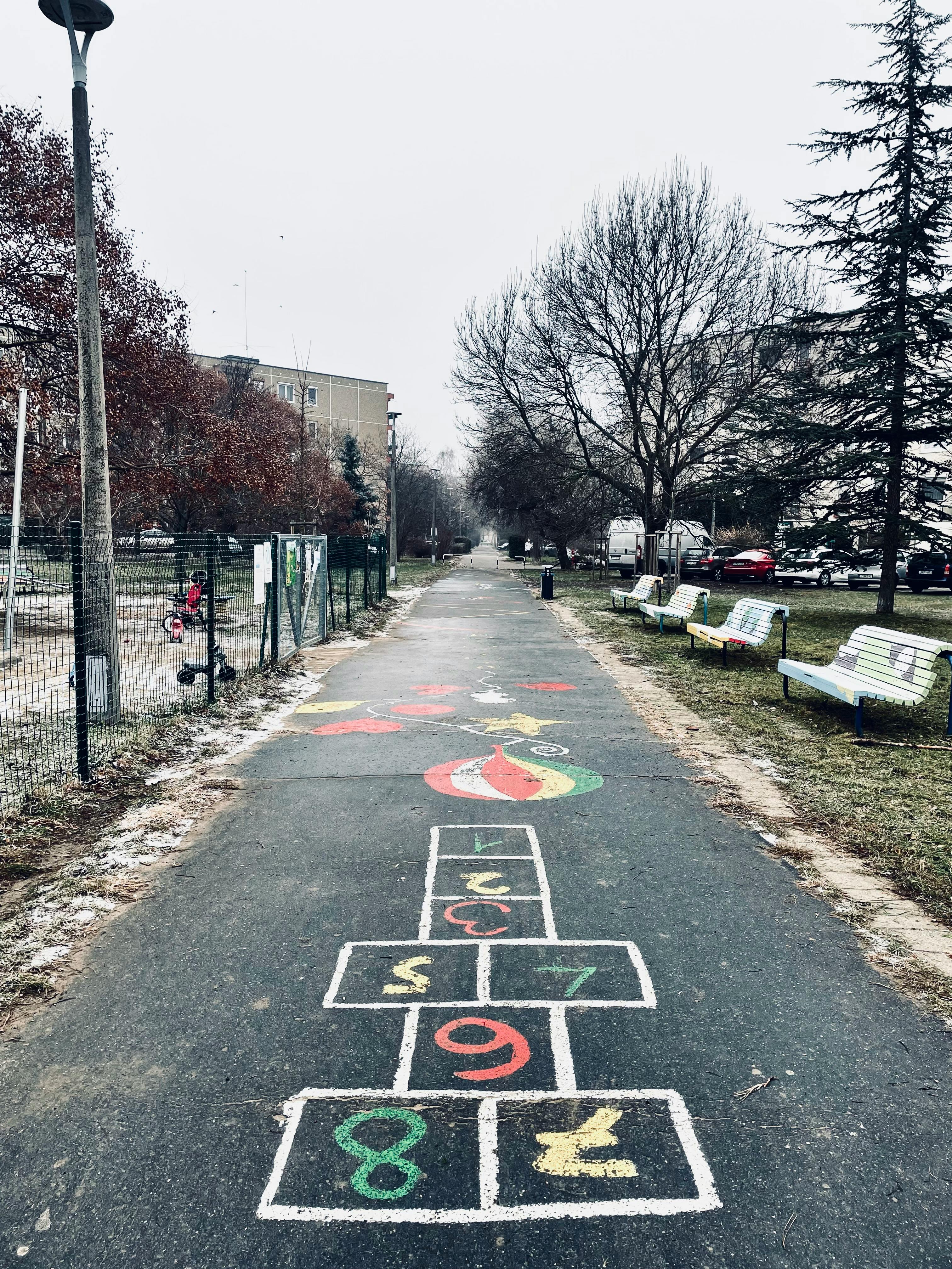 Colorful hopscotch game on city pathway · Free Stock Photo