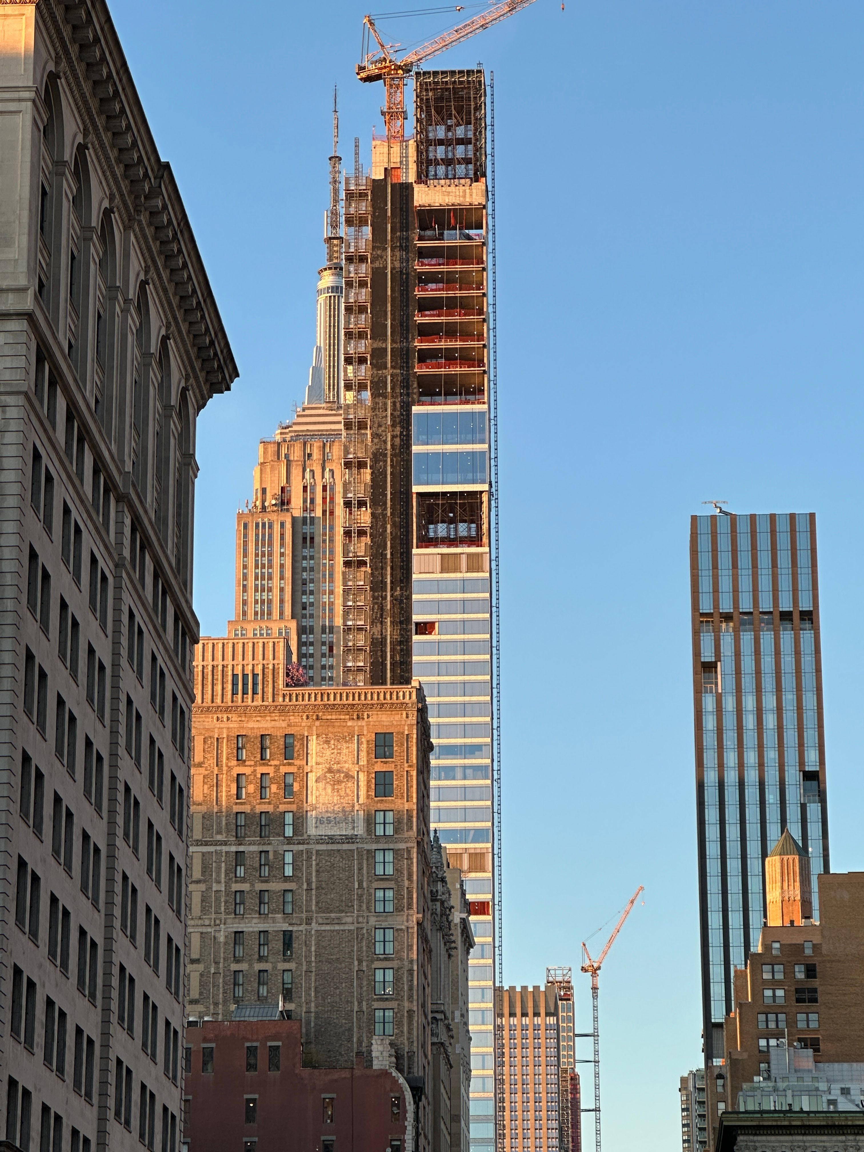 New York City Skyscraper at Sunset with Cranes · Free Stock Photo