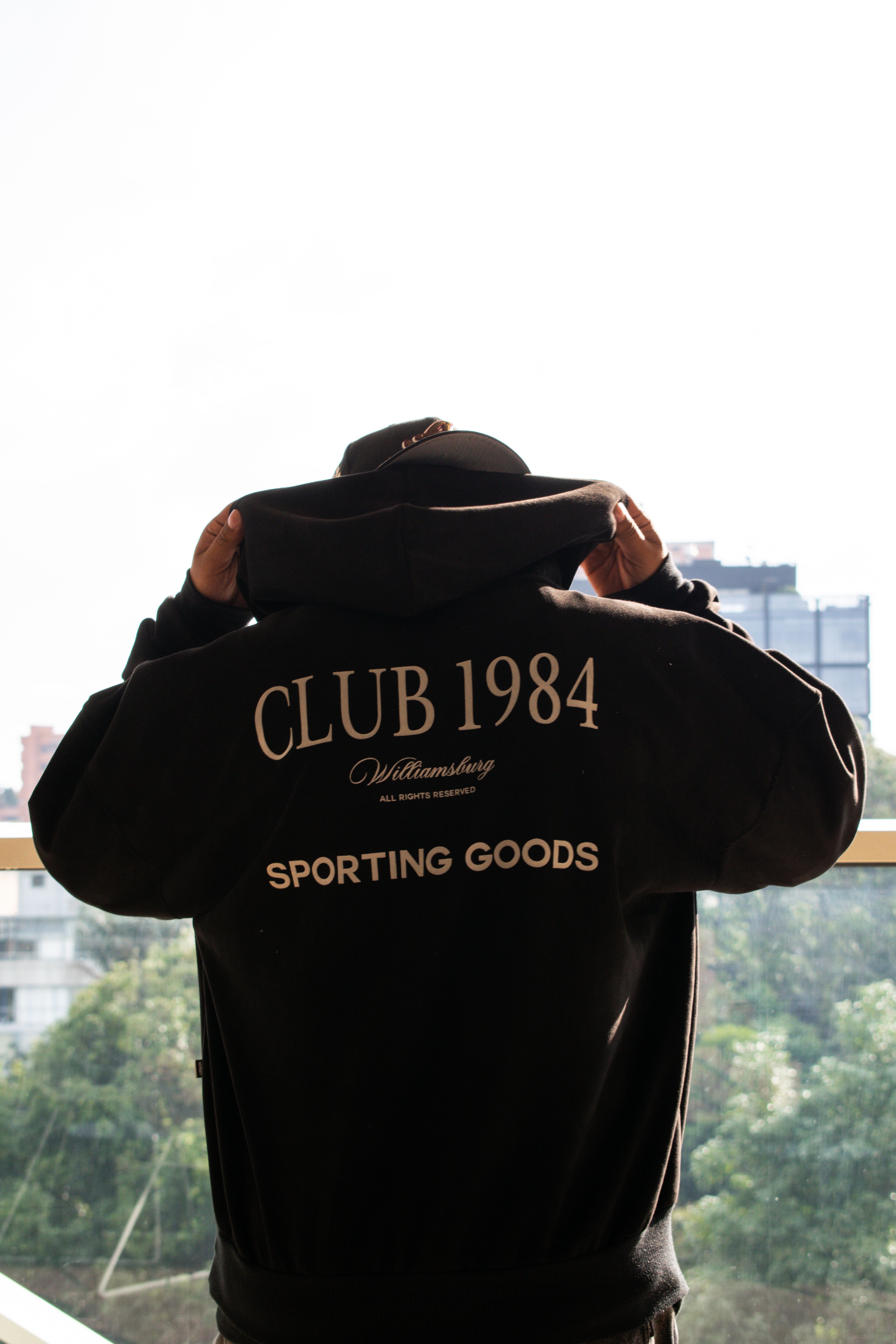 Casual Hoodie with Club 1984 Design Outdoors · Free Stock Photo