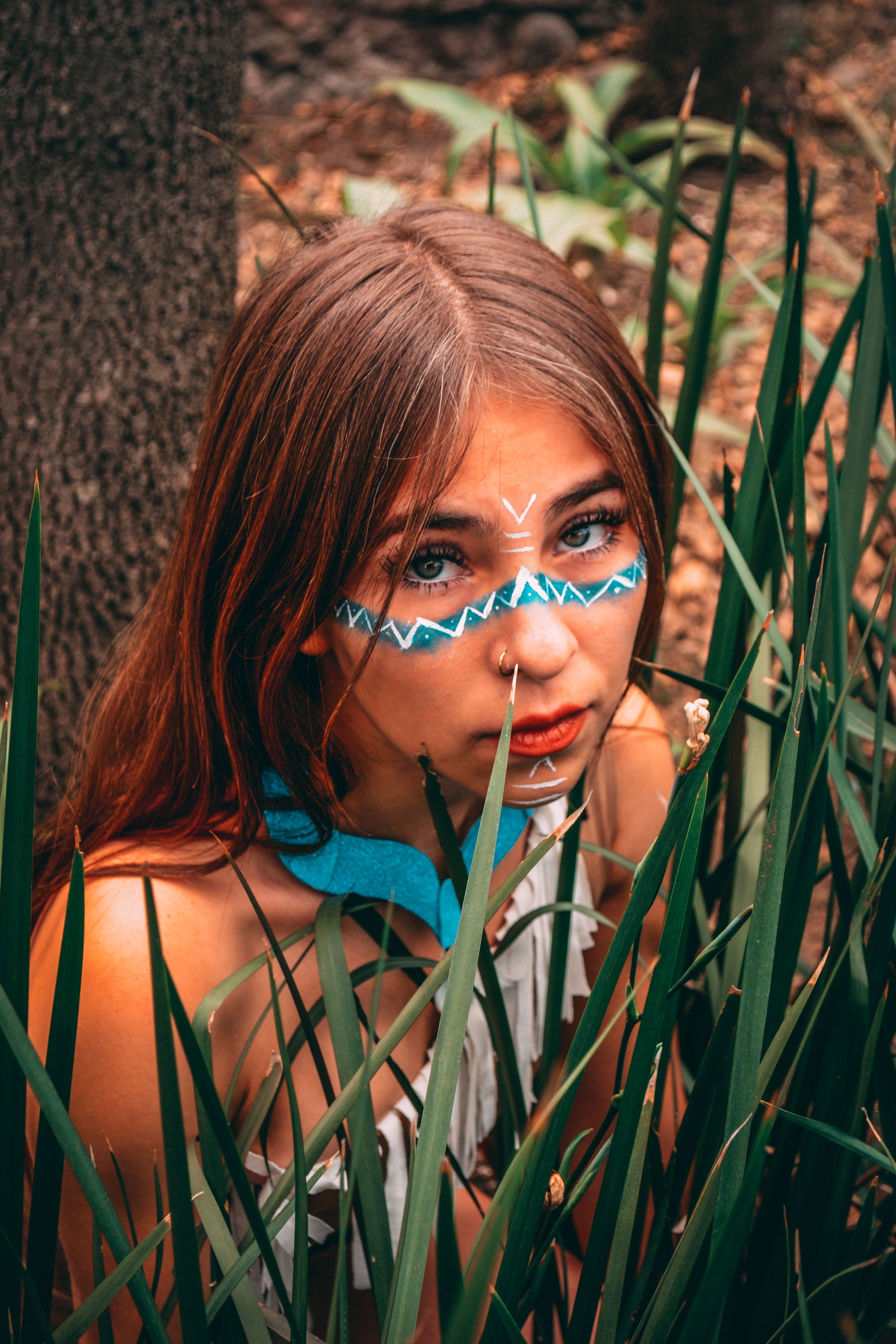 Enchanting Forest Cosplay with Tribal Face Paint · Free Stock Photo