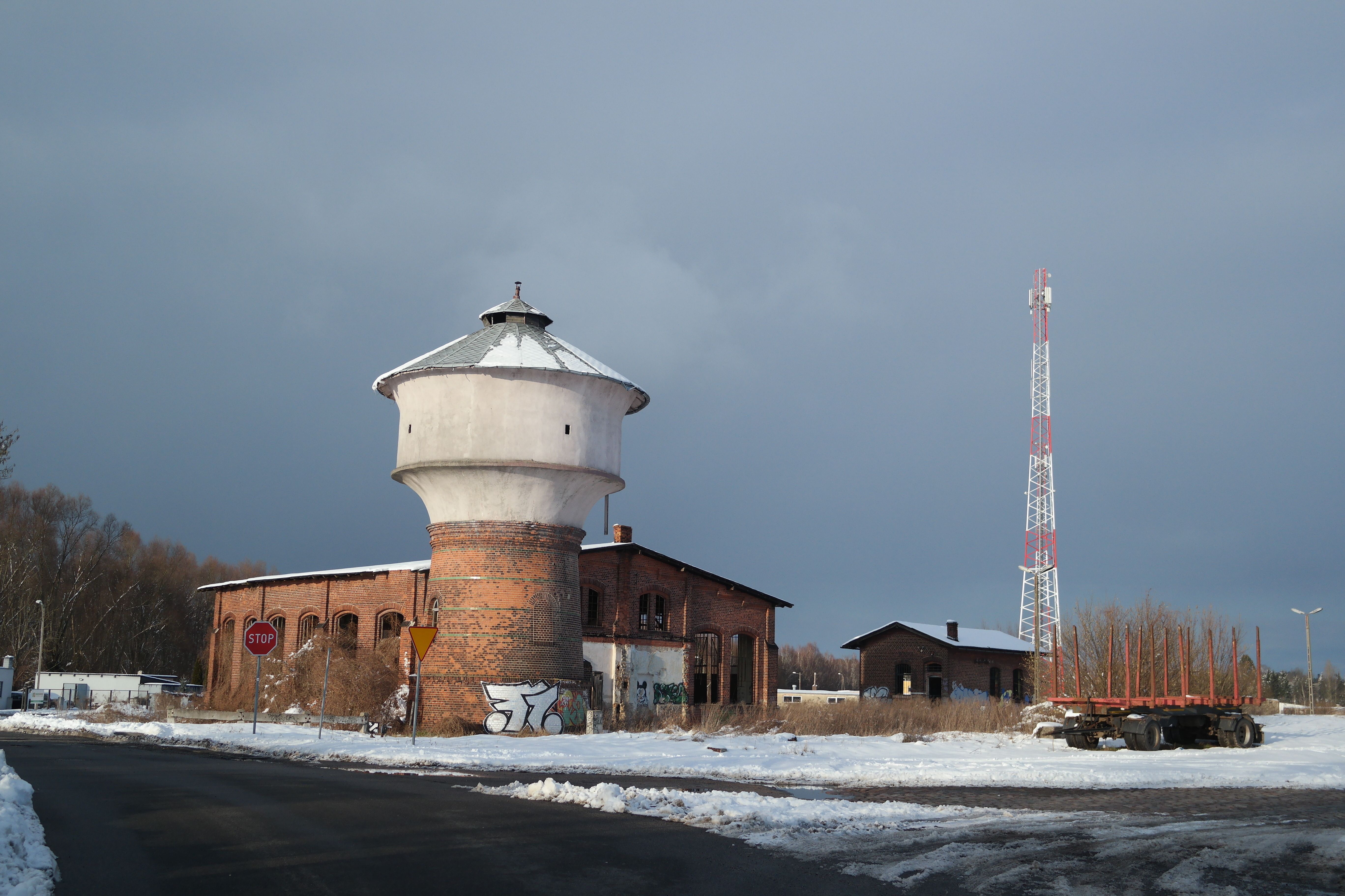 Winter Scene of Old Water Tower and Buildings · Free Stock Photo