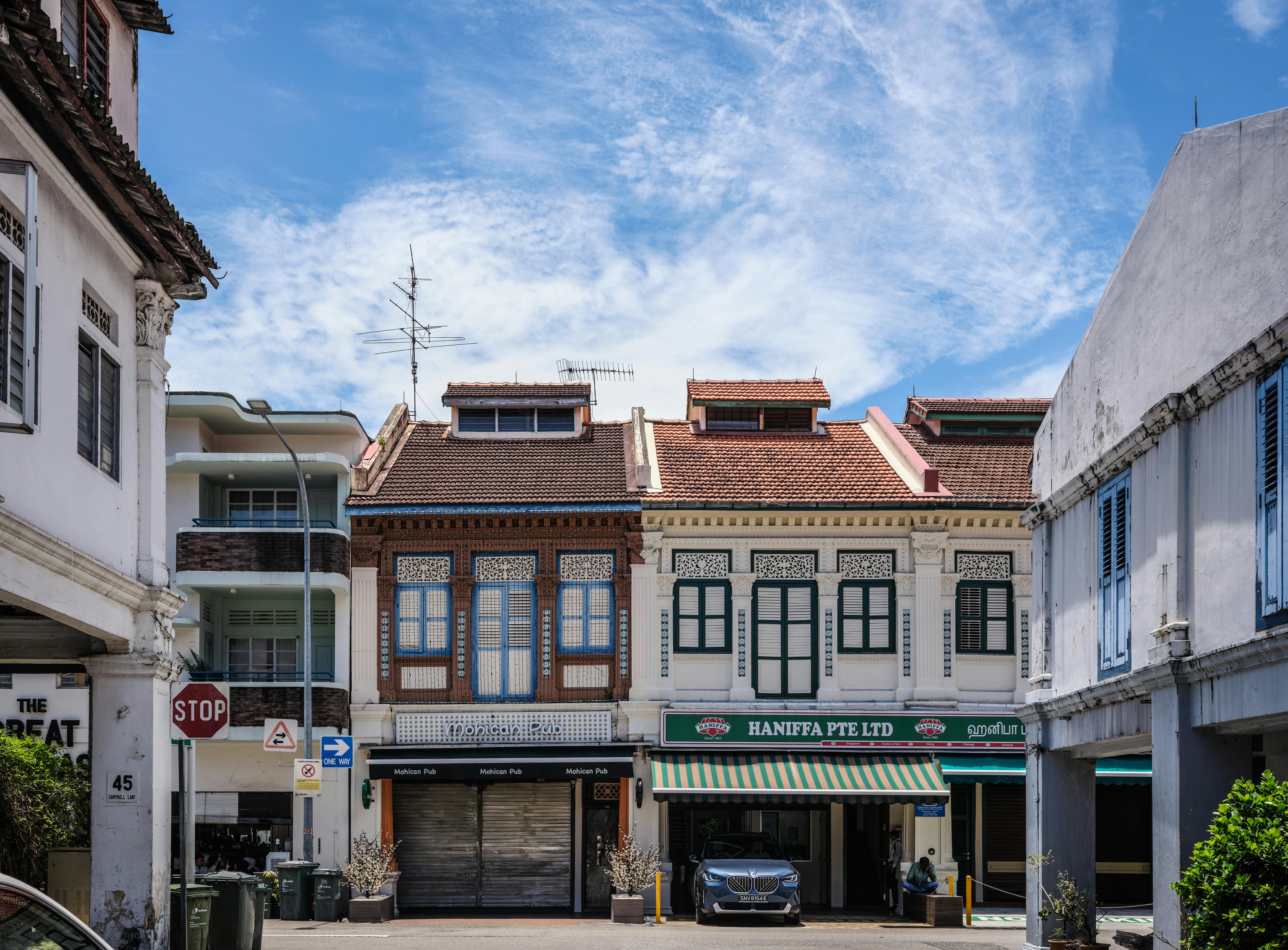 Charming Historical Street Scene with Shops · Free Stock Photo