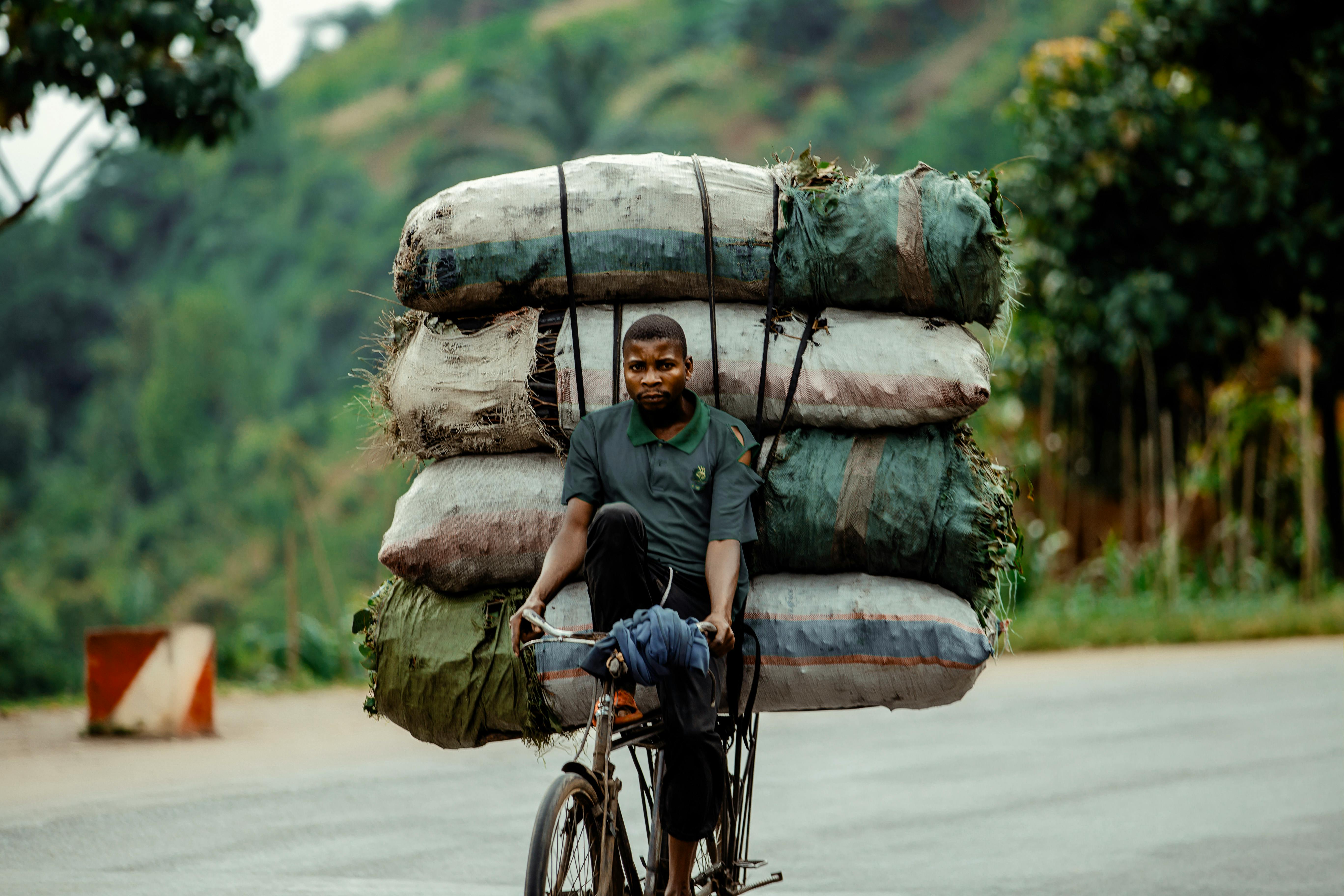 Man transporting goods on a bicycle · Free Stock Photo