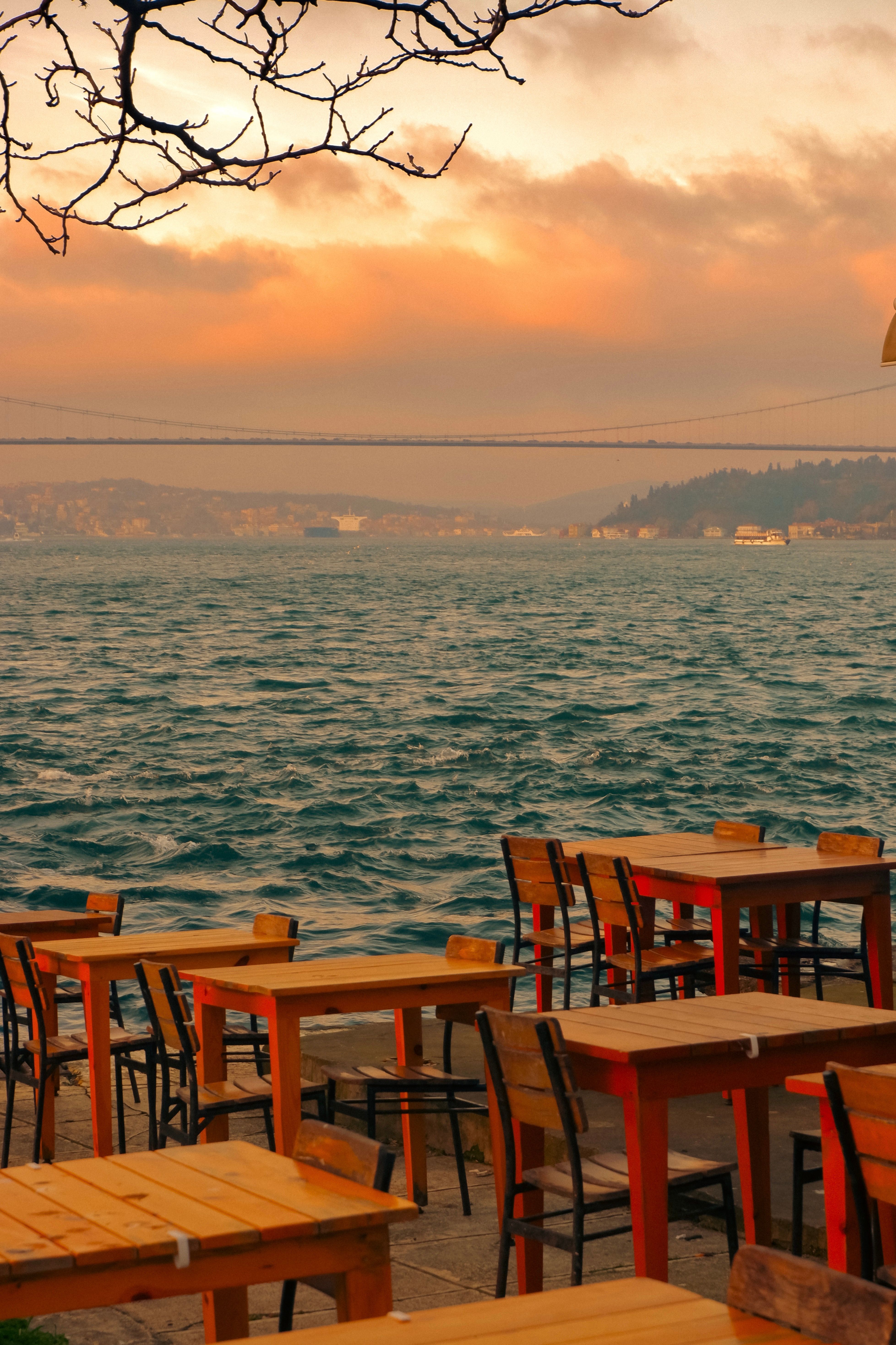 Quaint Waterfront Café at Sunset · Free Stock Photo