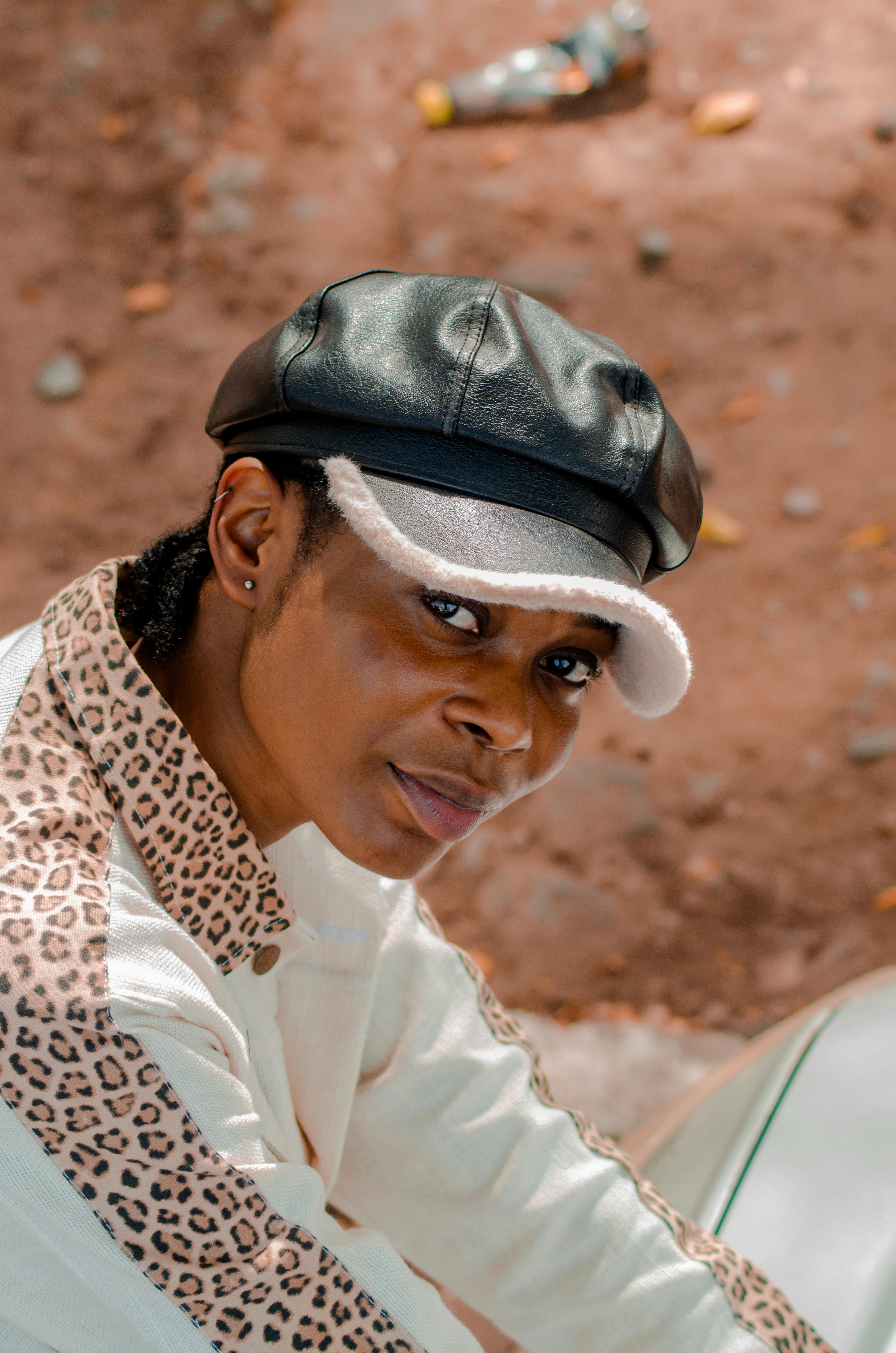 Stylish Portrait of Woman in Leather Cap Outdoors · Free Stock Photo