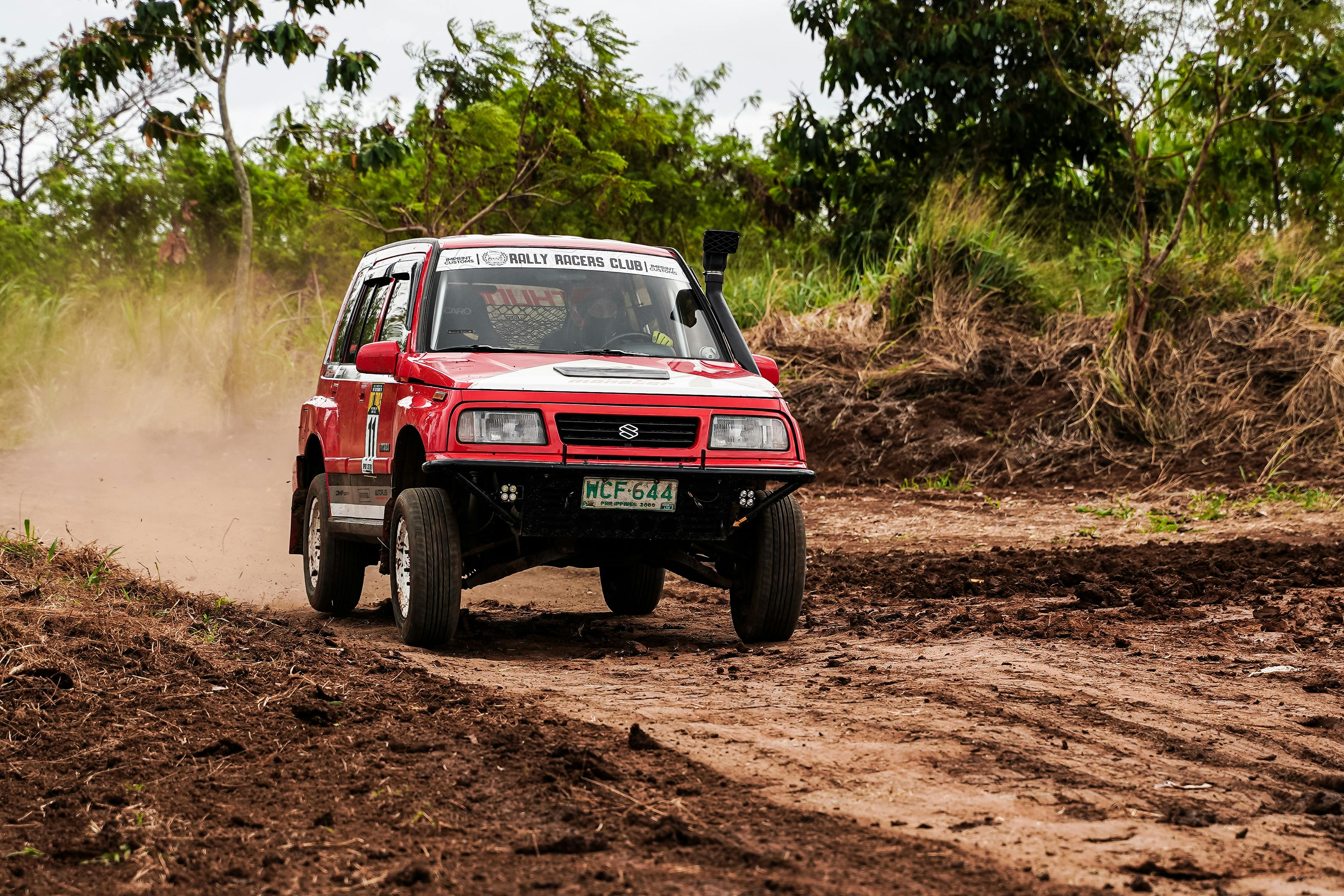 Exciting Off-road Rally Car Racing on Dirt Track · Free Stock Photo