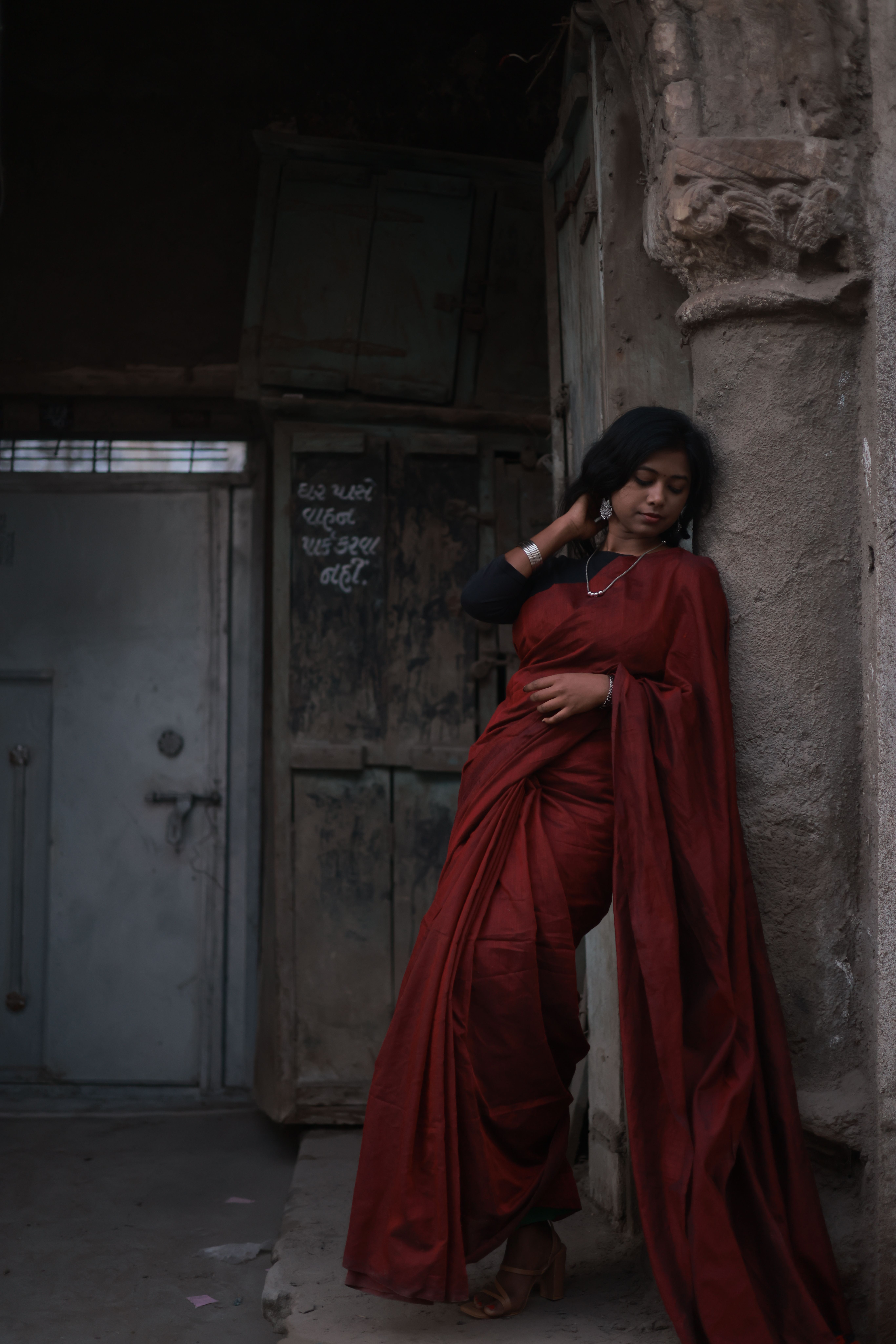 Elegant Woman in Red Sari Posing Indoors · Free Stock Photo