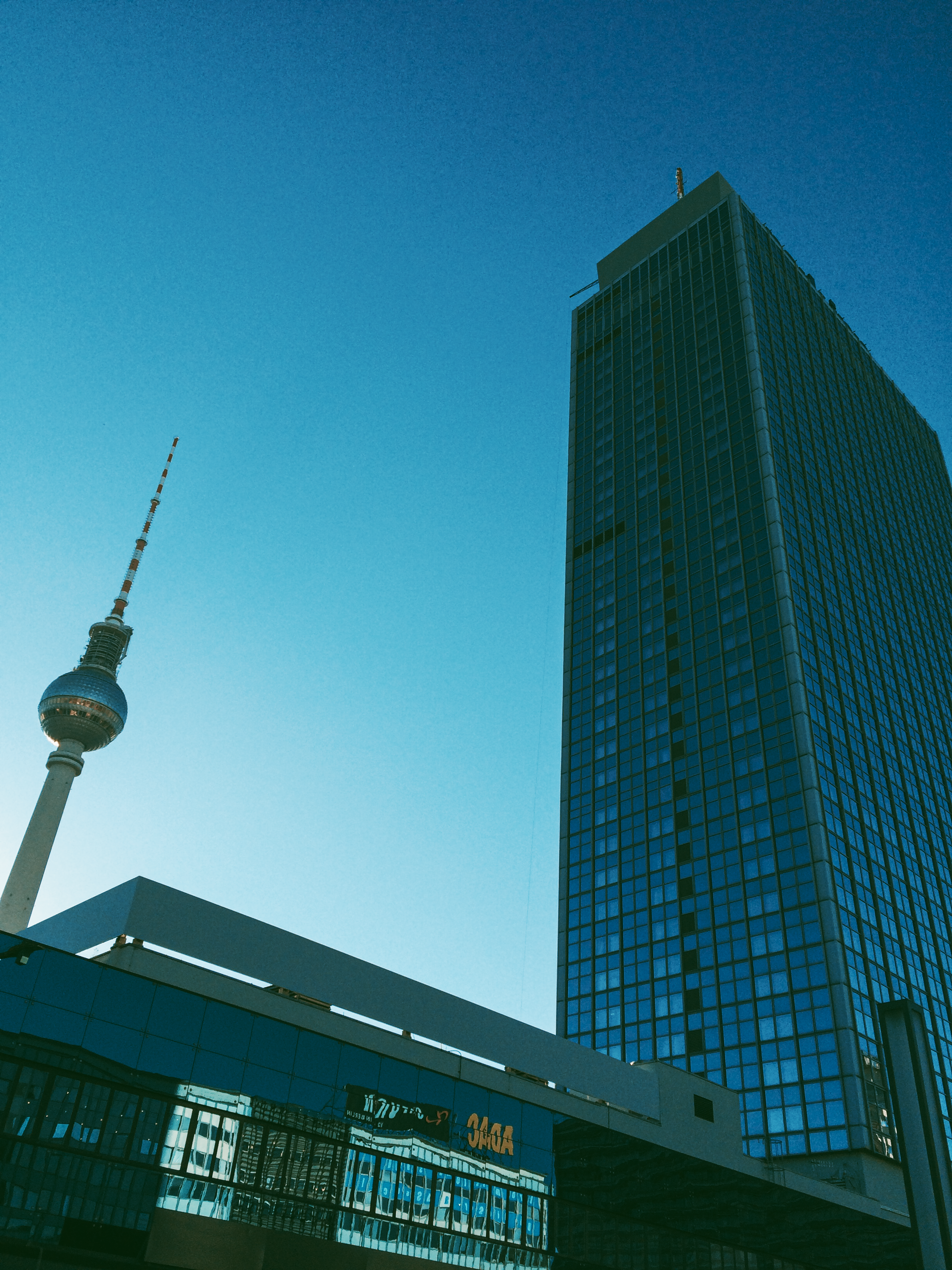 Berlin TV Tower and Modern Skyscraper in Daylight · Free Stock Photo