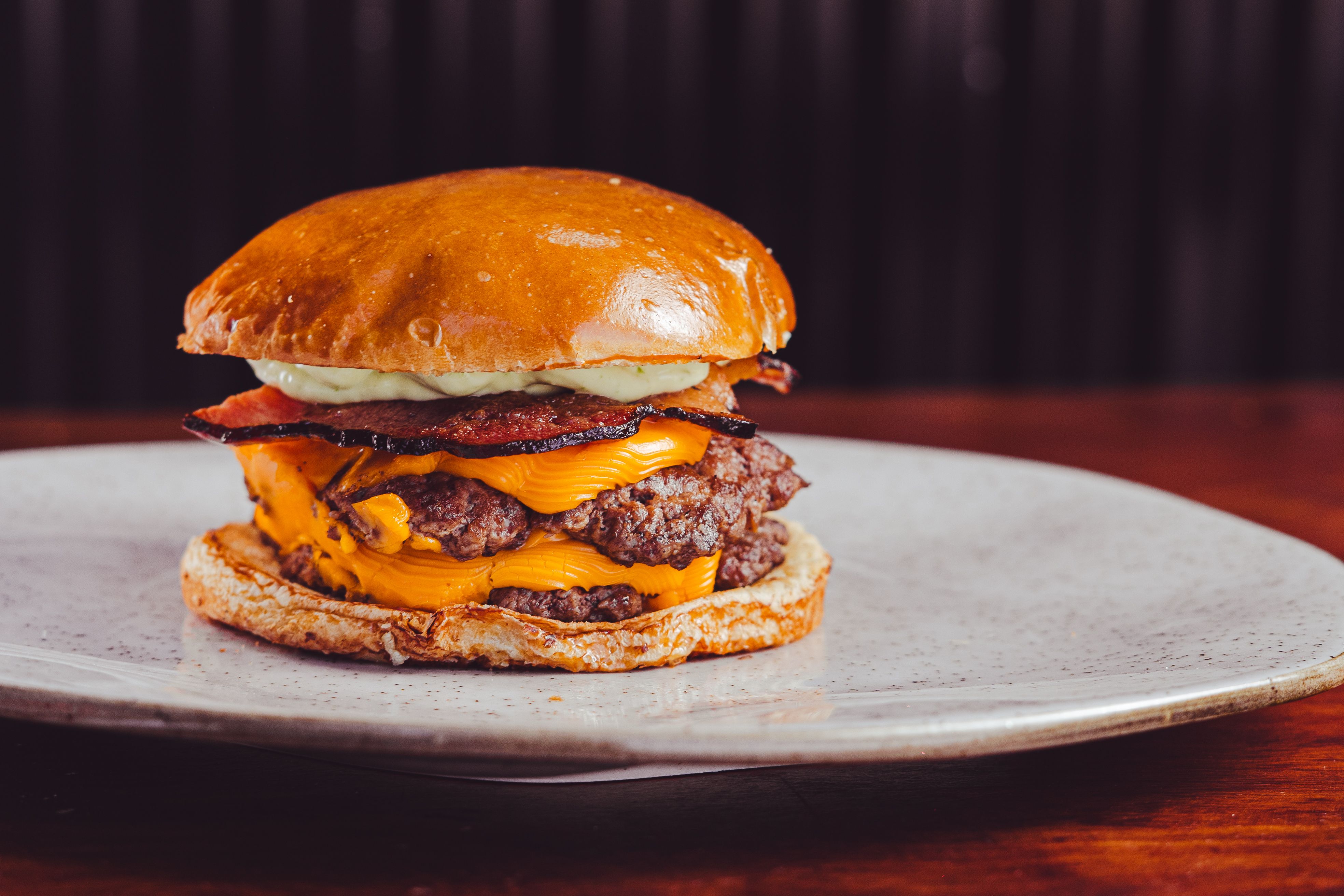 Delicious Cheeseburger with Bacon on Plate · Free Stock Photo
