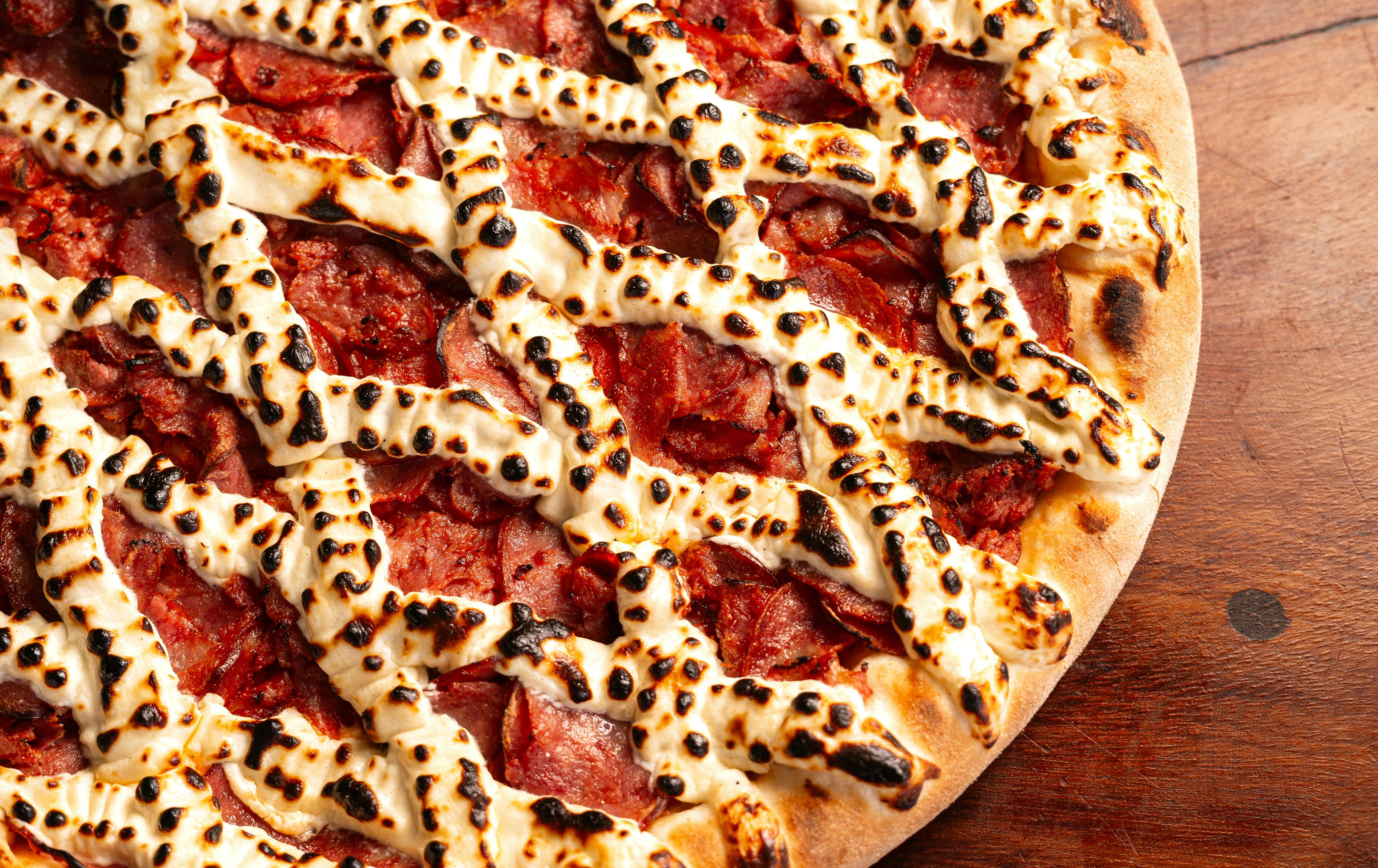 Delicious Pepperoni Pizza with Burnt Cheese Topping · Free Stock Photo