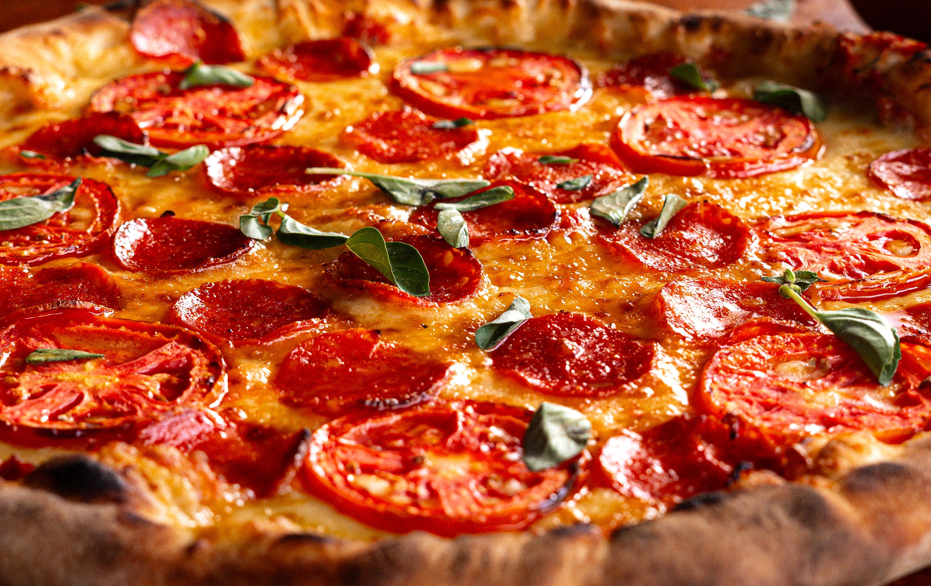 Delicious Pepperoni Pizza with Fresh Tomatoes · Free Stock Photo