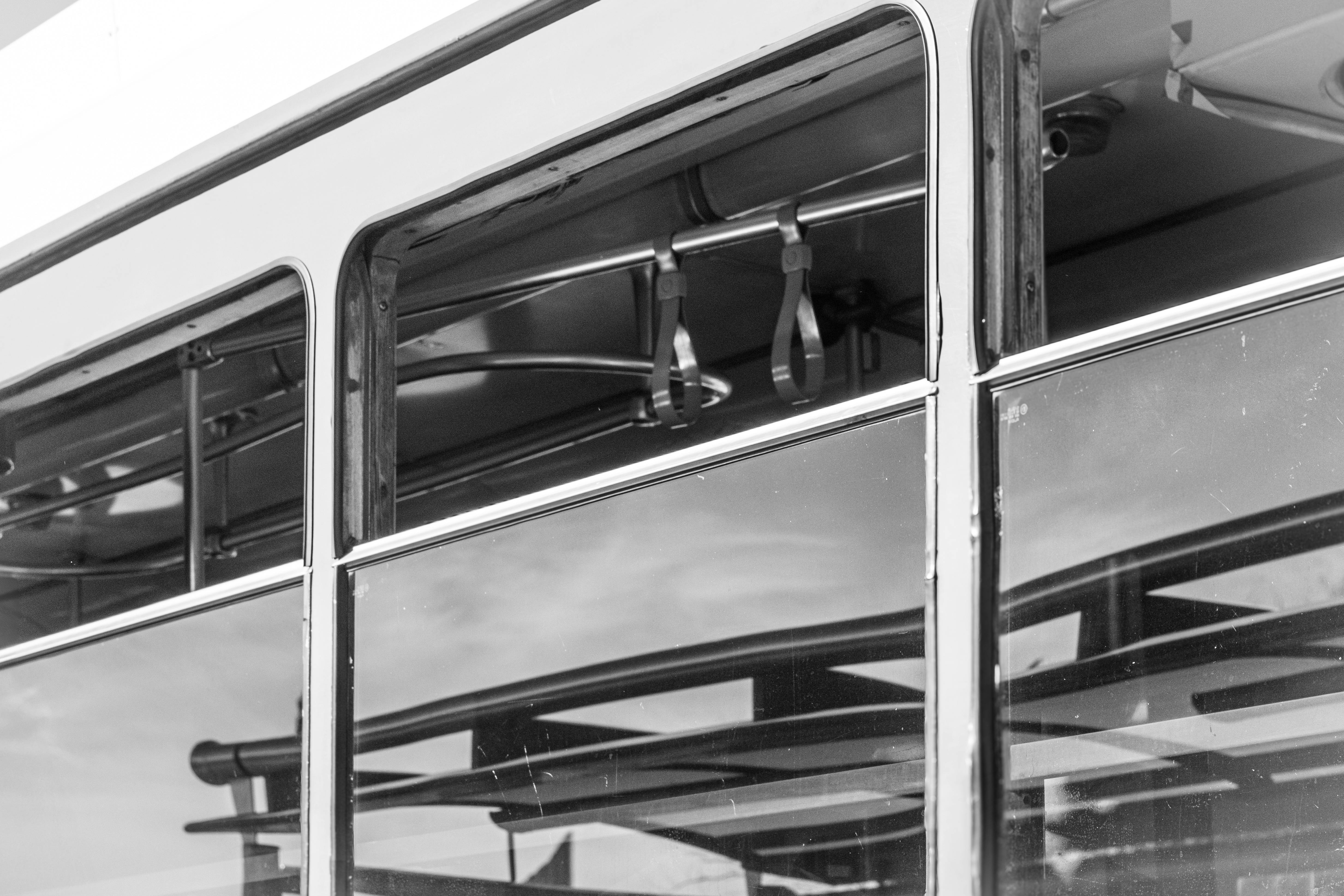 Black and White Vintage Bus Window Close-Up · Free Stock Photo