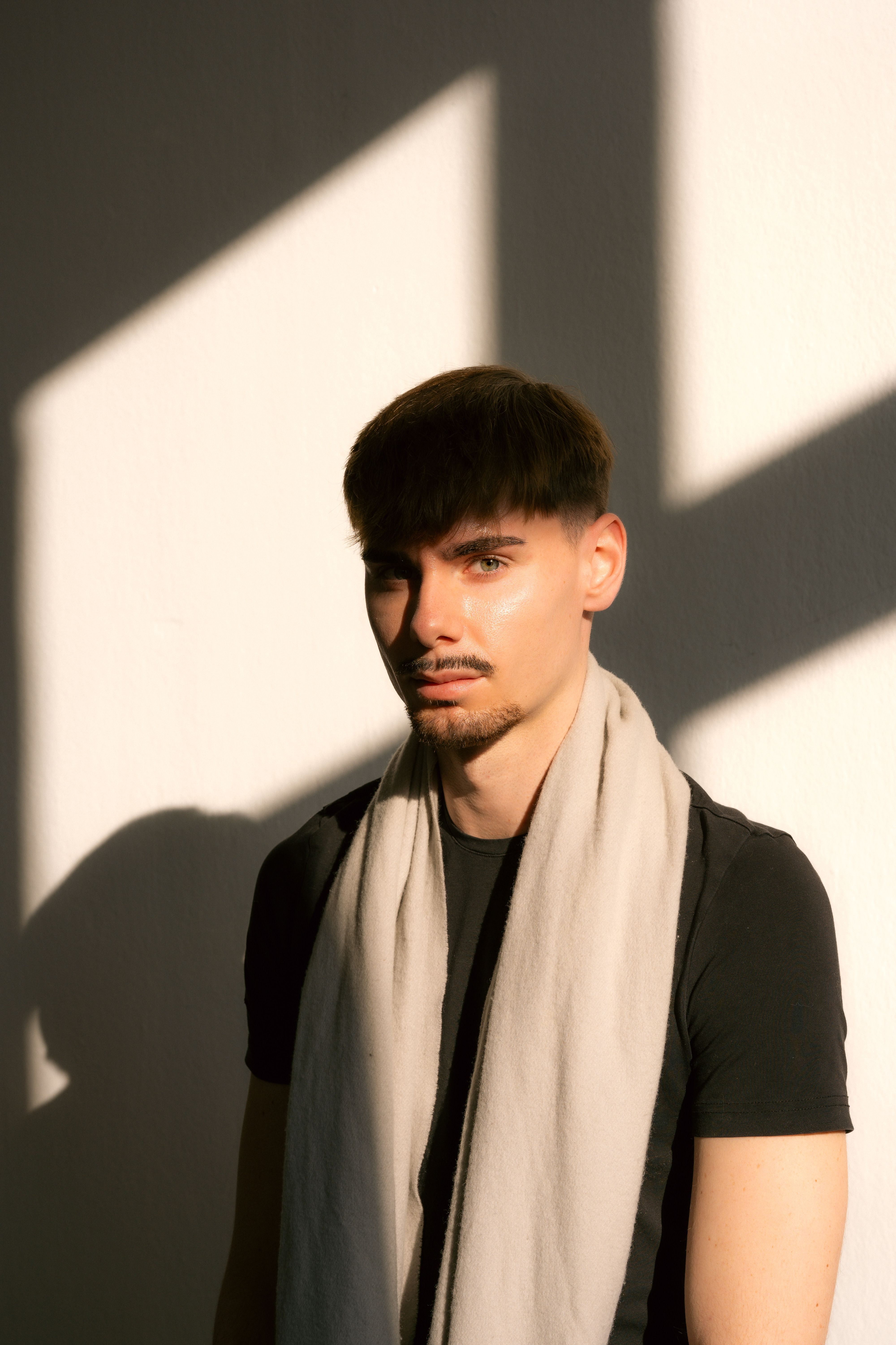 Young Man in Shadowy Indoor Portrait Lighting · Free Stock Photo