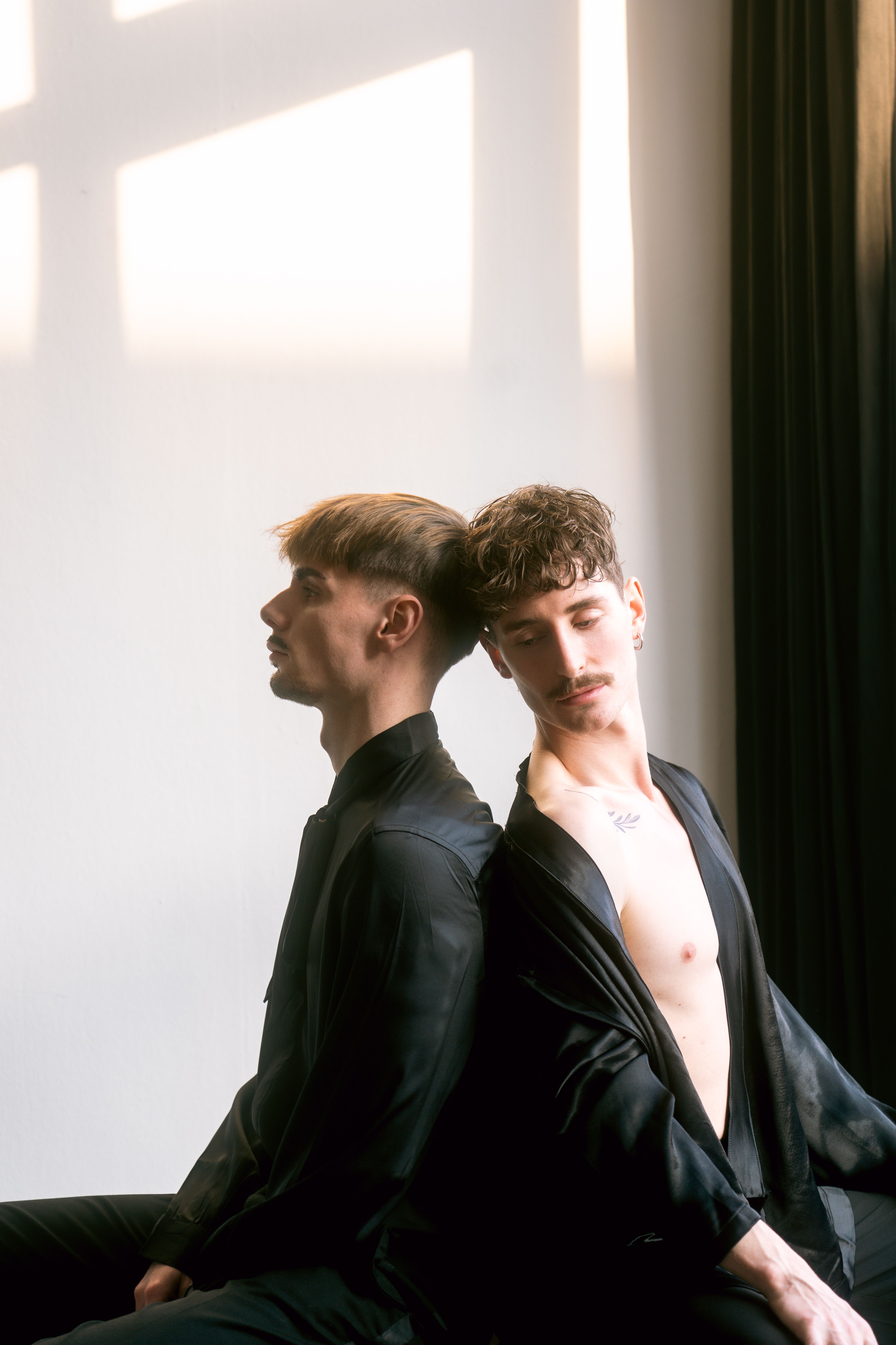 Artistic Portrait of Two Men in Dramatic Lighting · Free Stock Photo