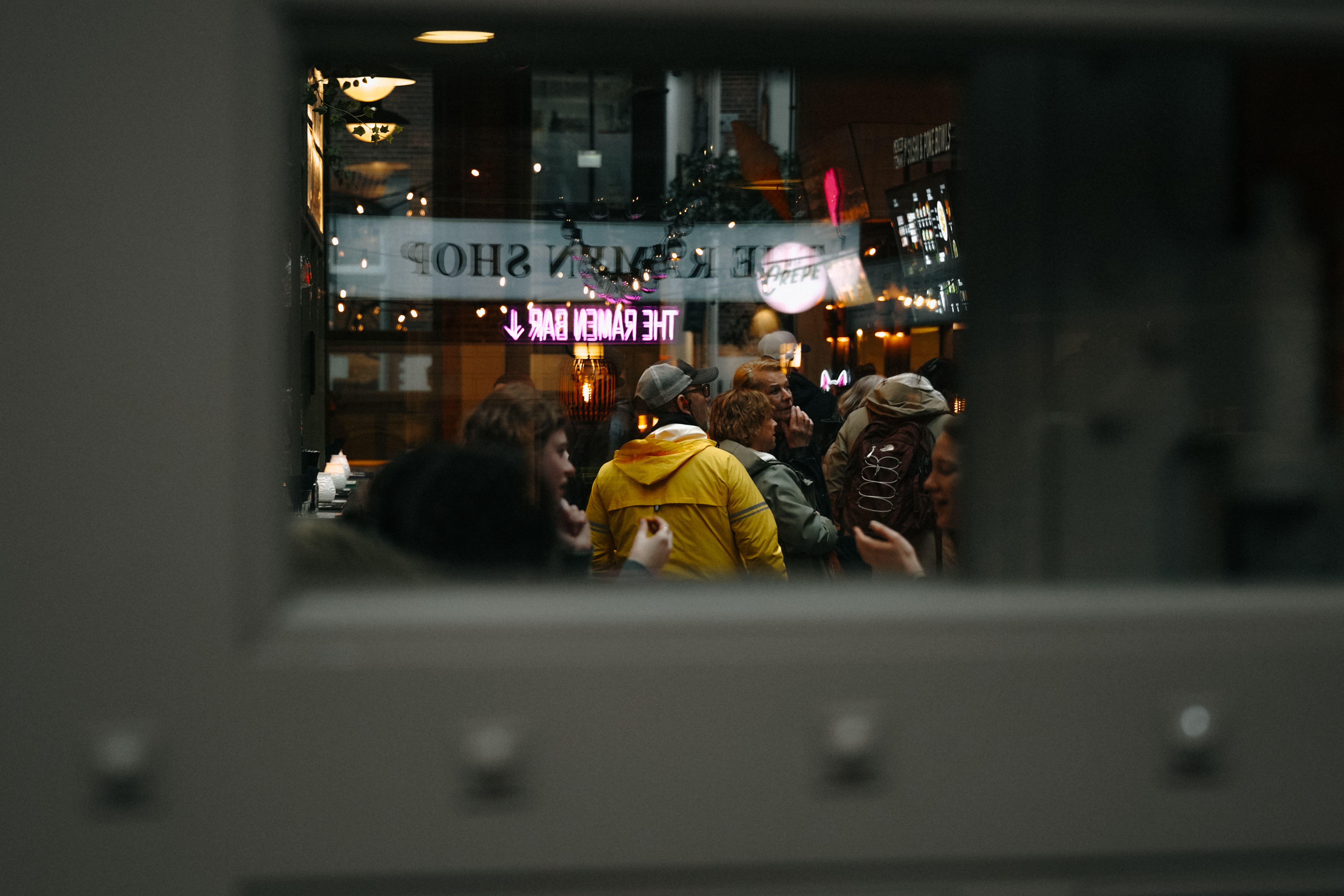 Candid street view of a lively Amsterdam cafe · Free Stock Photo