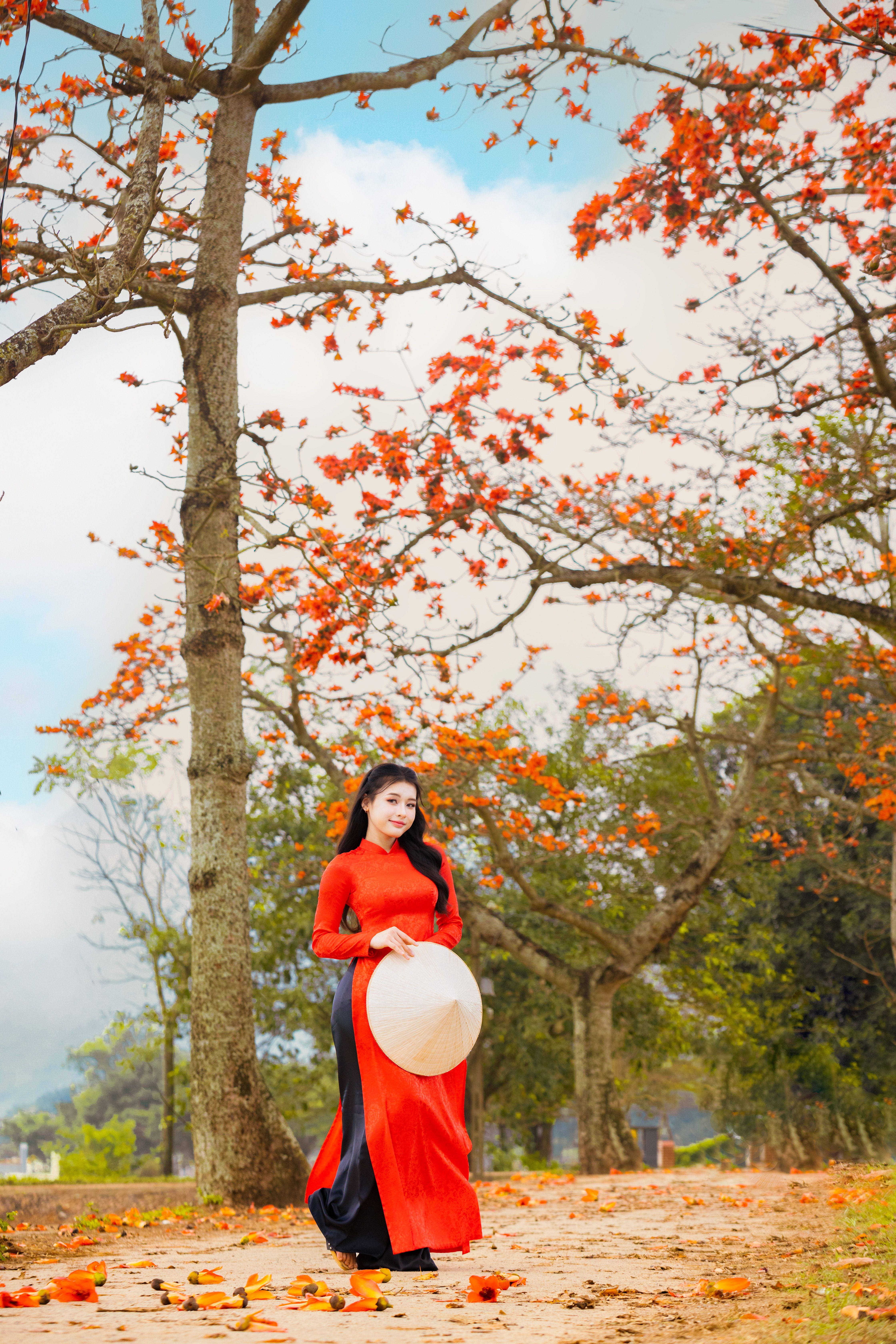 Woman in Red Dress Amidst Blooming Trees in Spring · Free Stock Photo