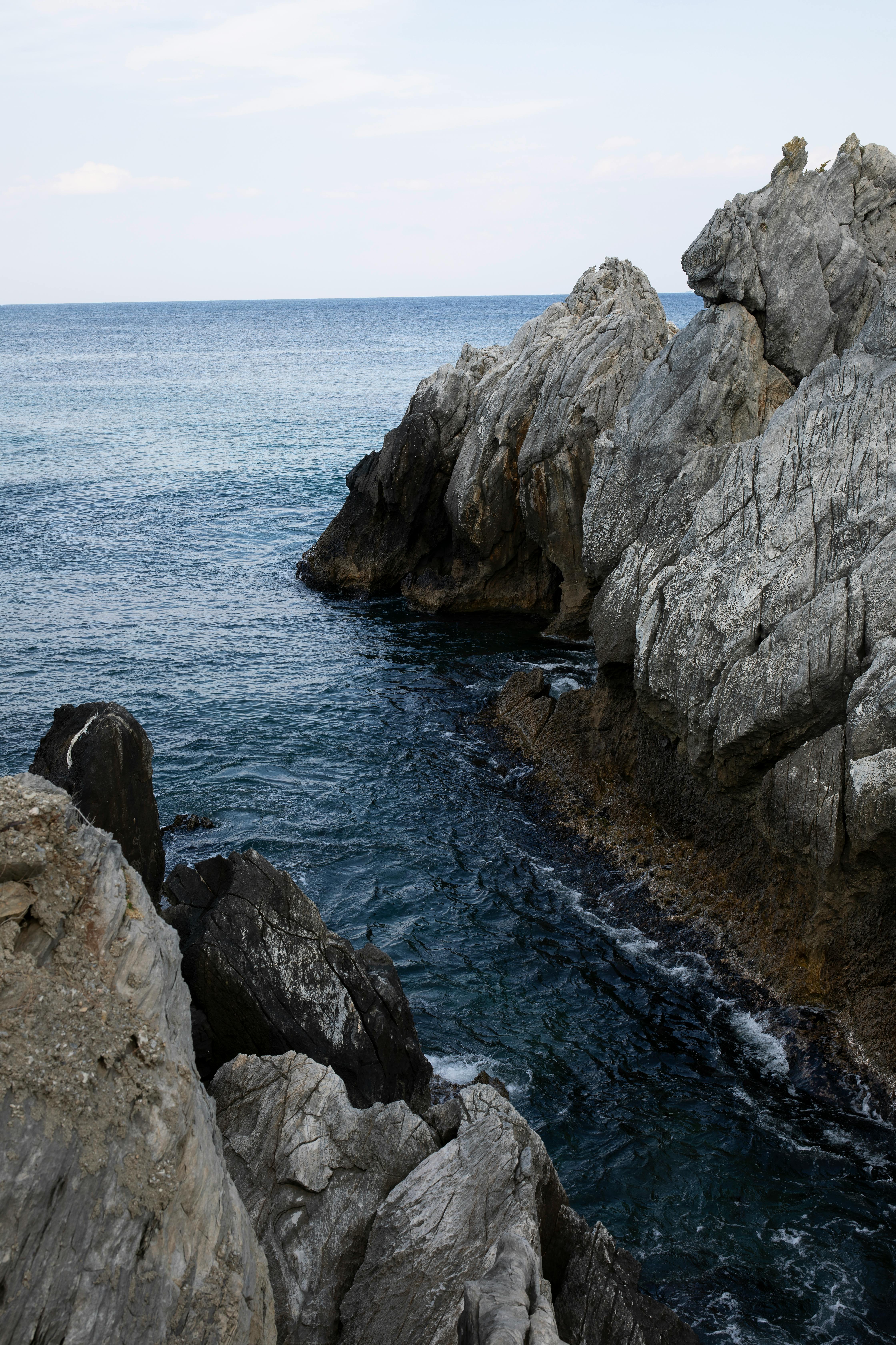 Dramatic Coastal Cliffside Overlooking the Sea · Free Stock Photo