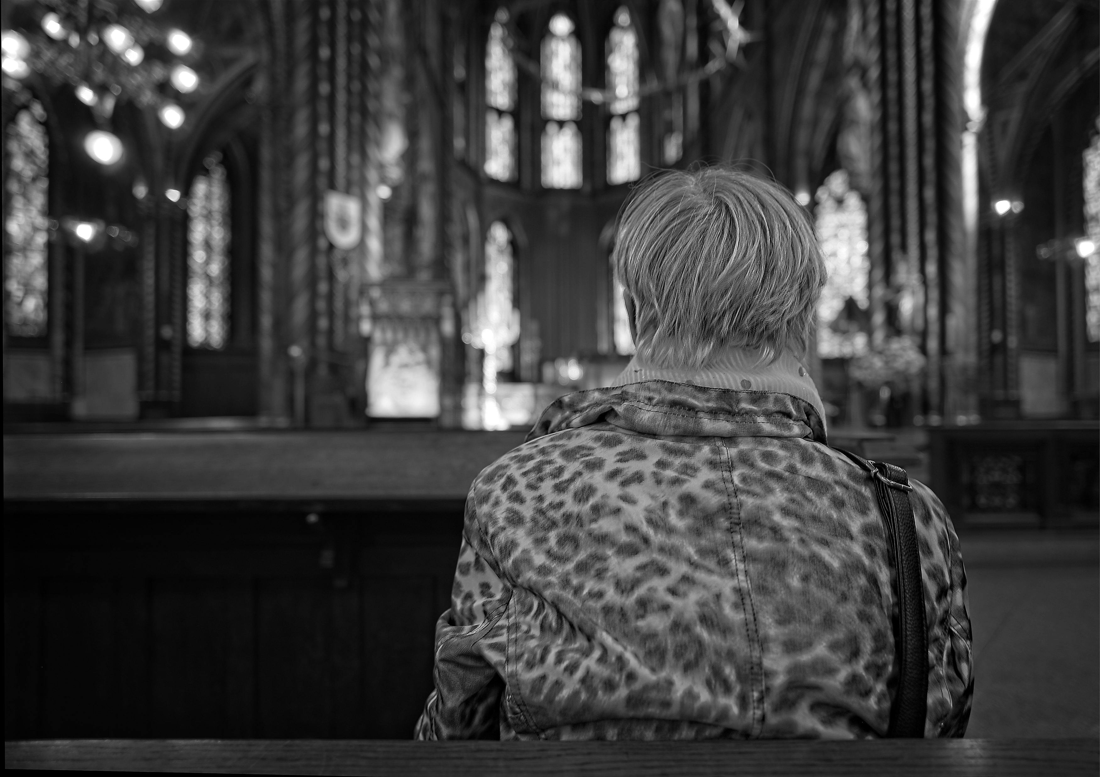 Reflective Silence in a Gothic Church Interior · Free Stock Photo