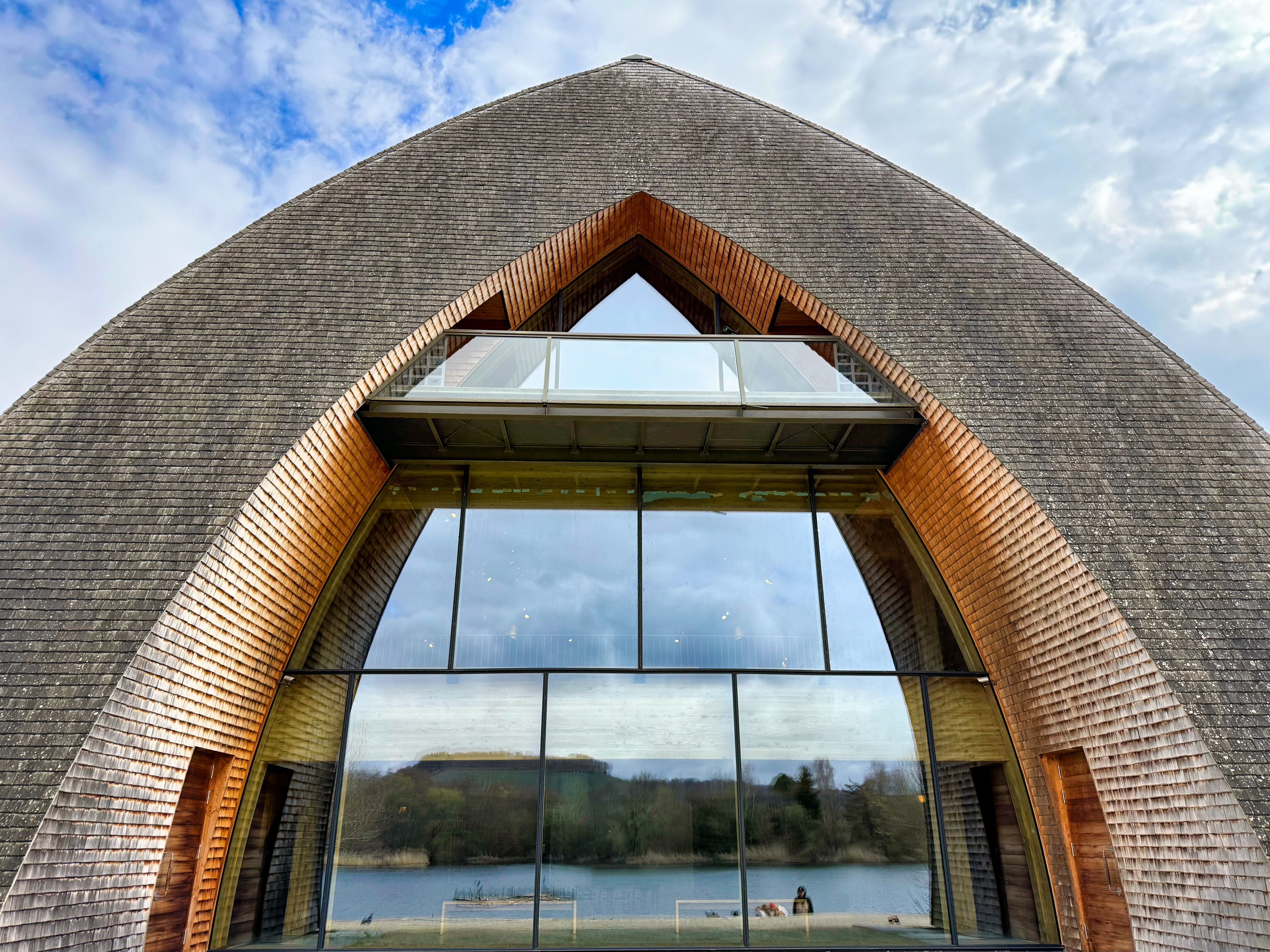 Modern Wooden Arch Building with Glass Facade · Free Stock Photo