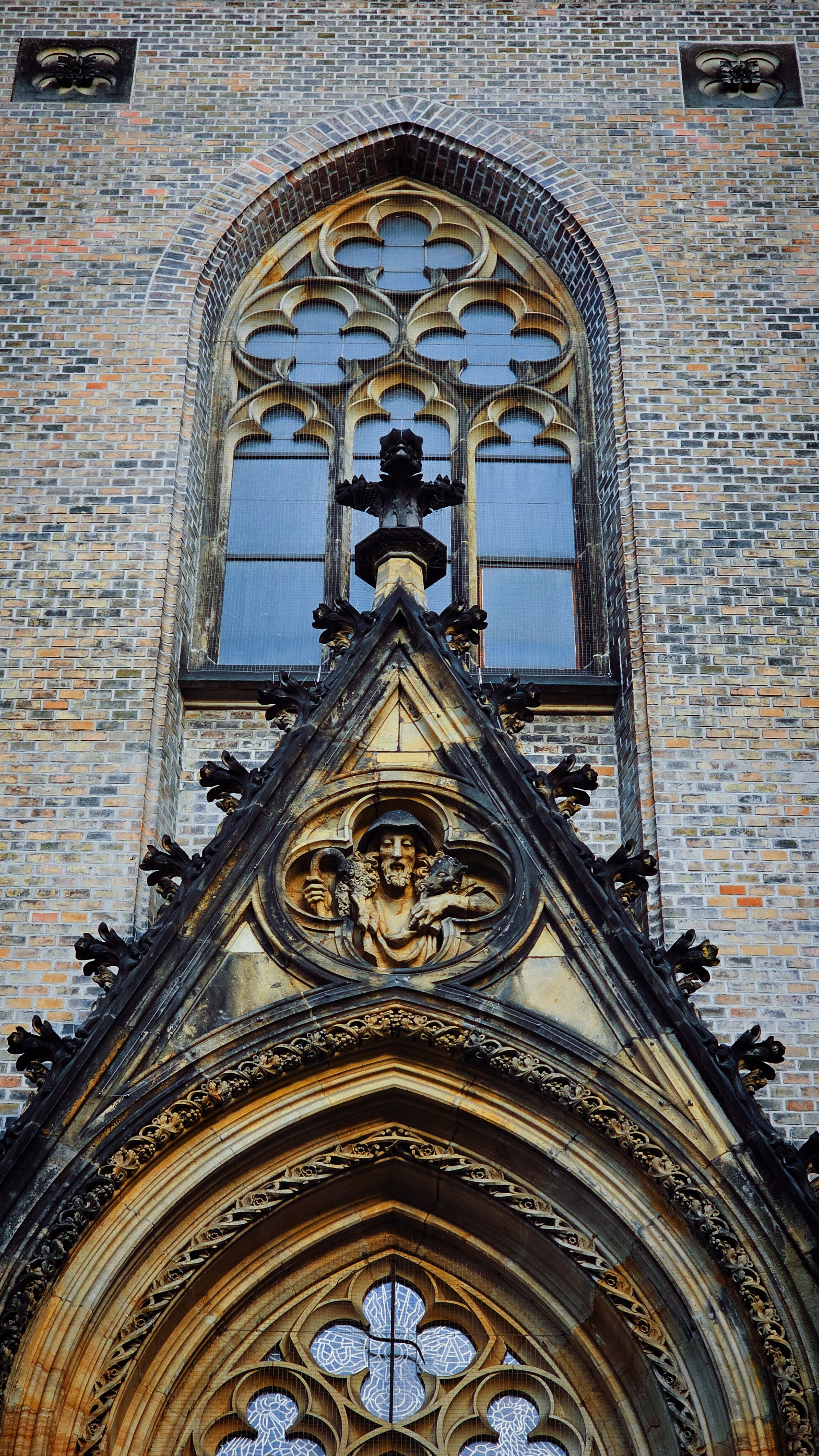 Gothic Cathedral Facade with Arched Windows · Free Stock Photo