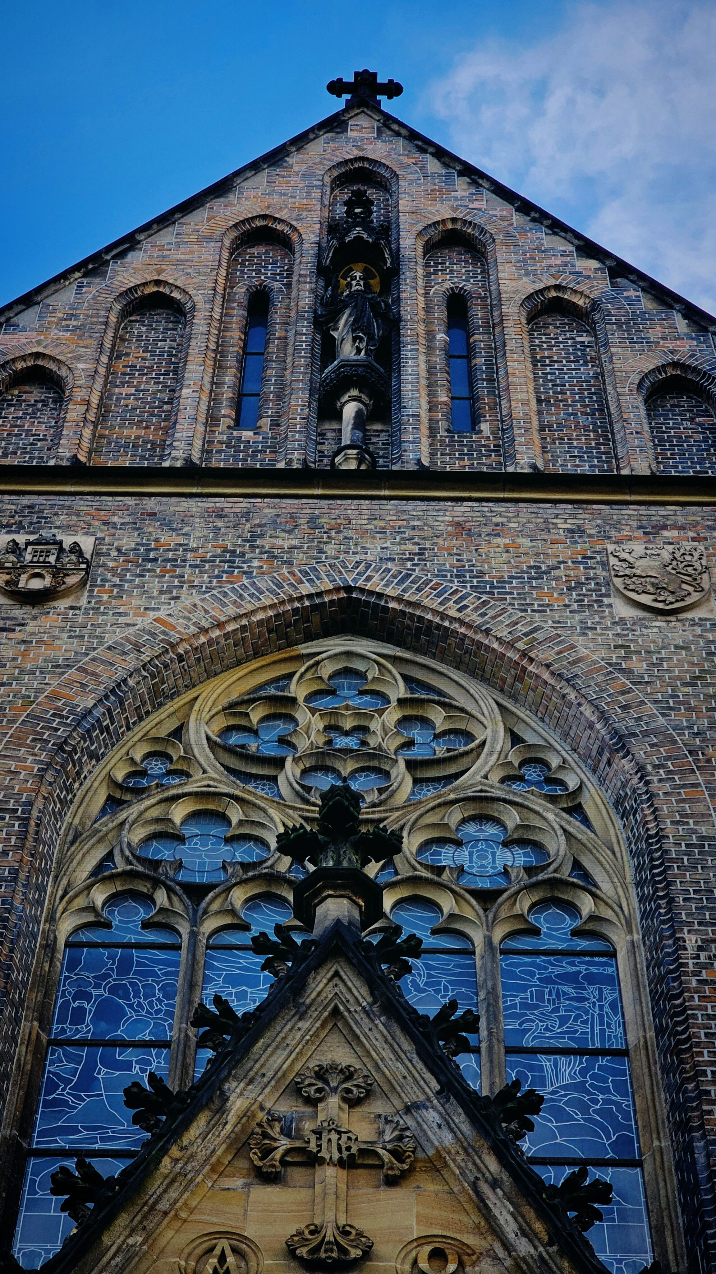 Gothic Architecture Facade with Stained Glass Window · Free Stock Photo